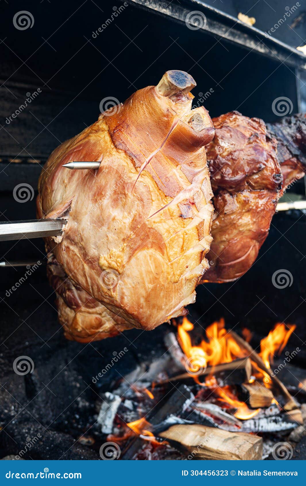 Pork Leg are Roasted on a Spit on a Grill Outside Stock Image - Image ...