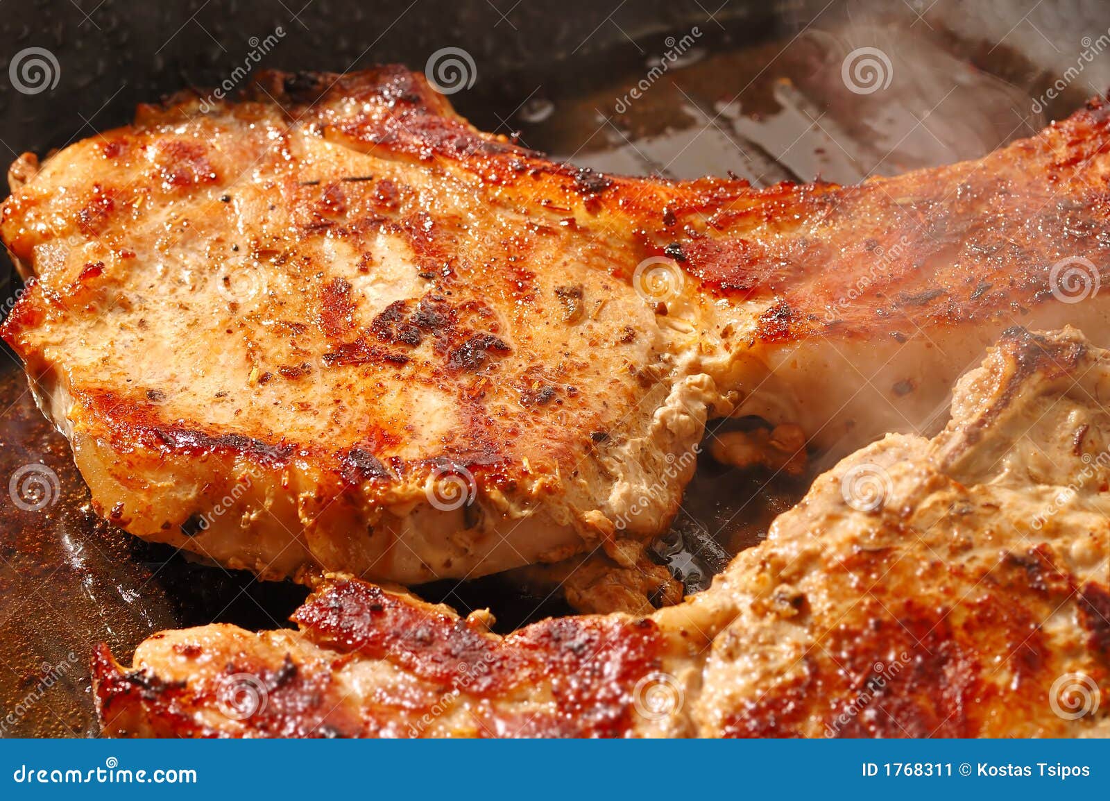 Pork steak cooked stock image. Image of hand, cook, cooking - 1768311