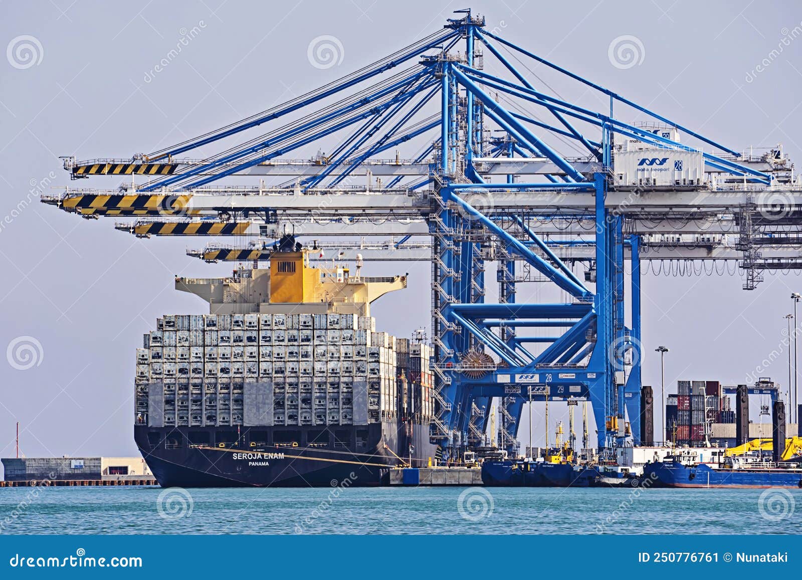 Discharging And Loading Of Containers. Editorial Photo | CartoonDealer ...