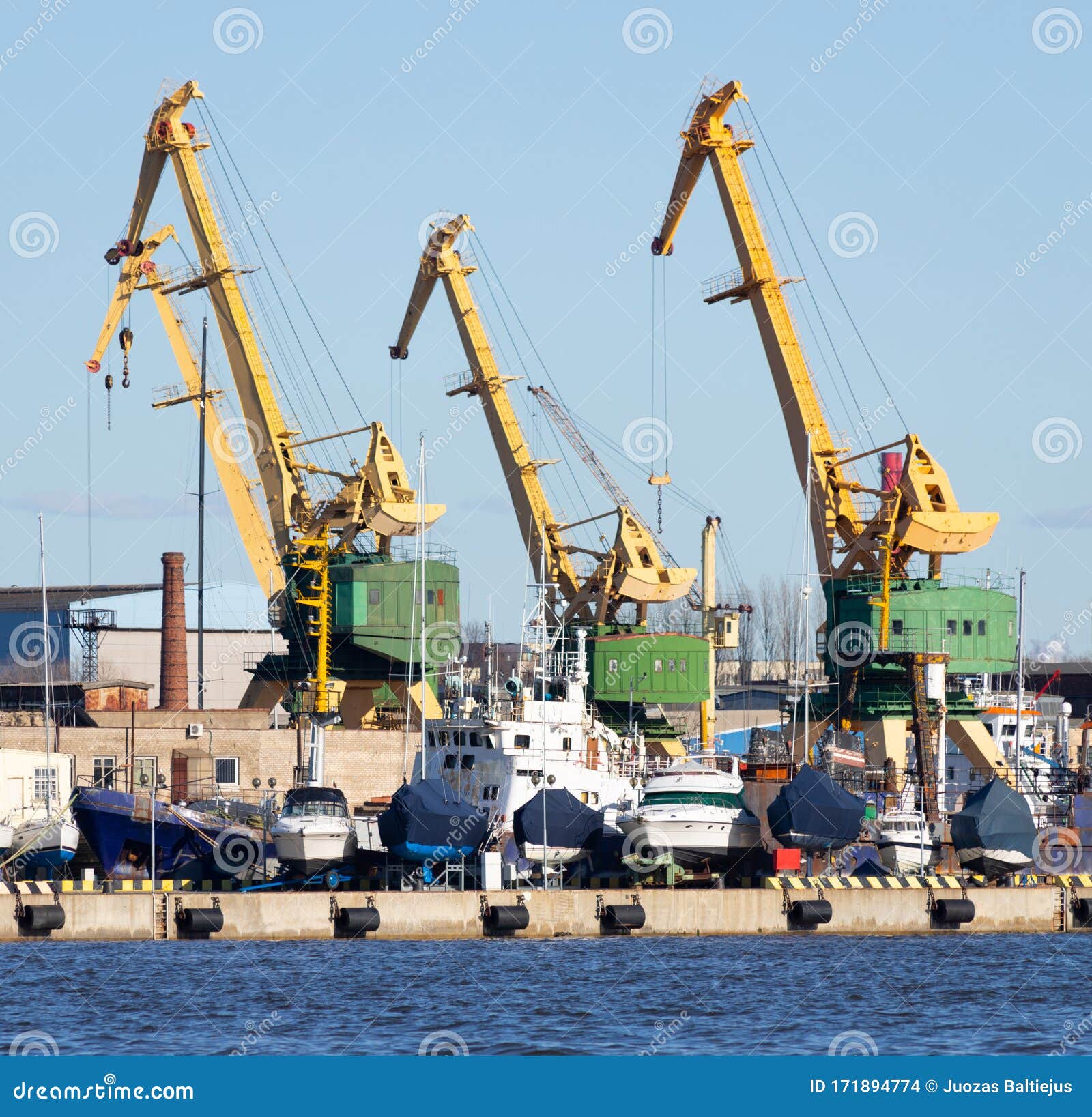 Cranes and Boats on the Harbor Quay Stock Photo - Image of boats ...