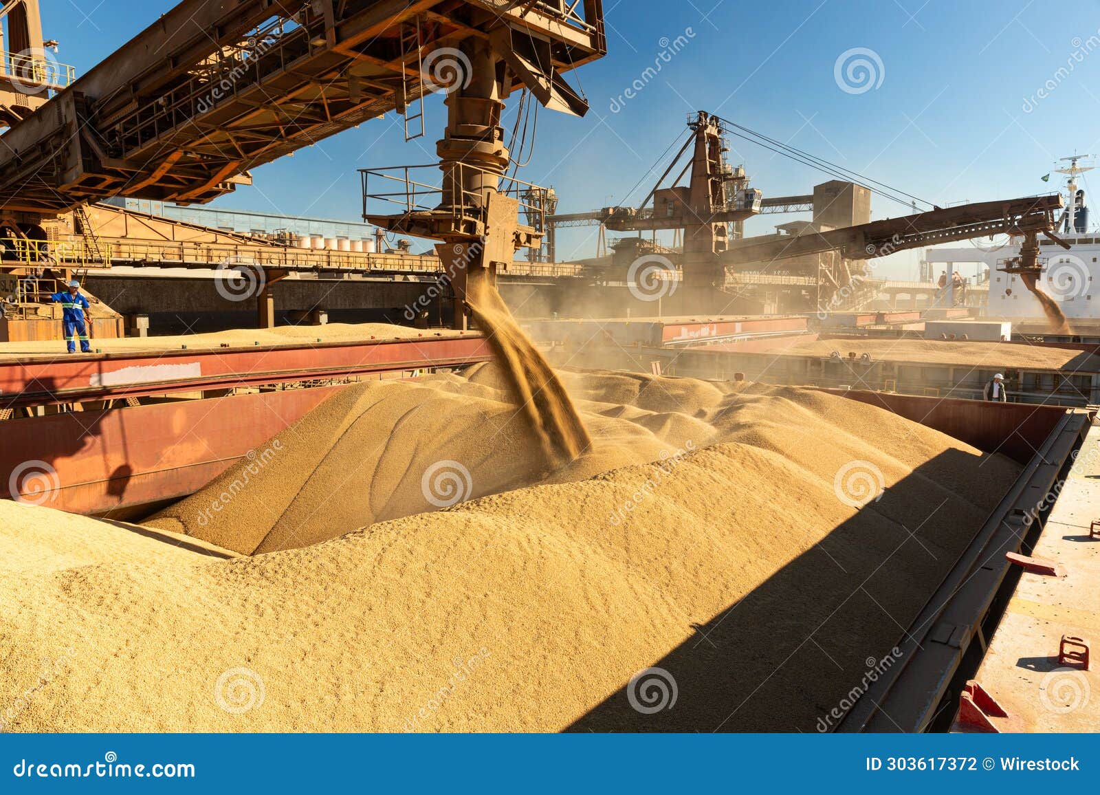 Crane Loading Soybeans Onto a Cargo Ship, with the Ship S Holds Full ...