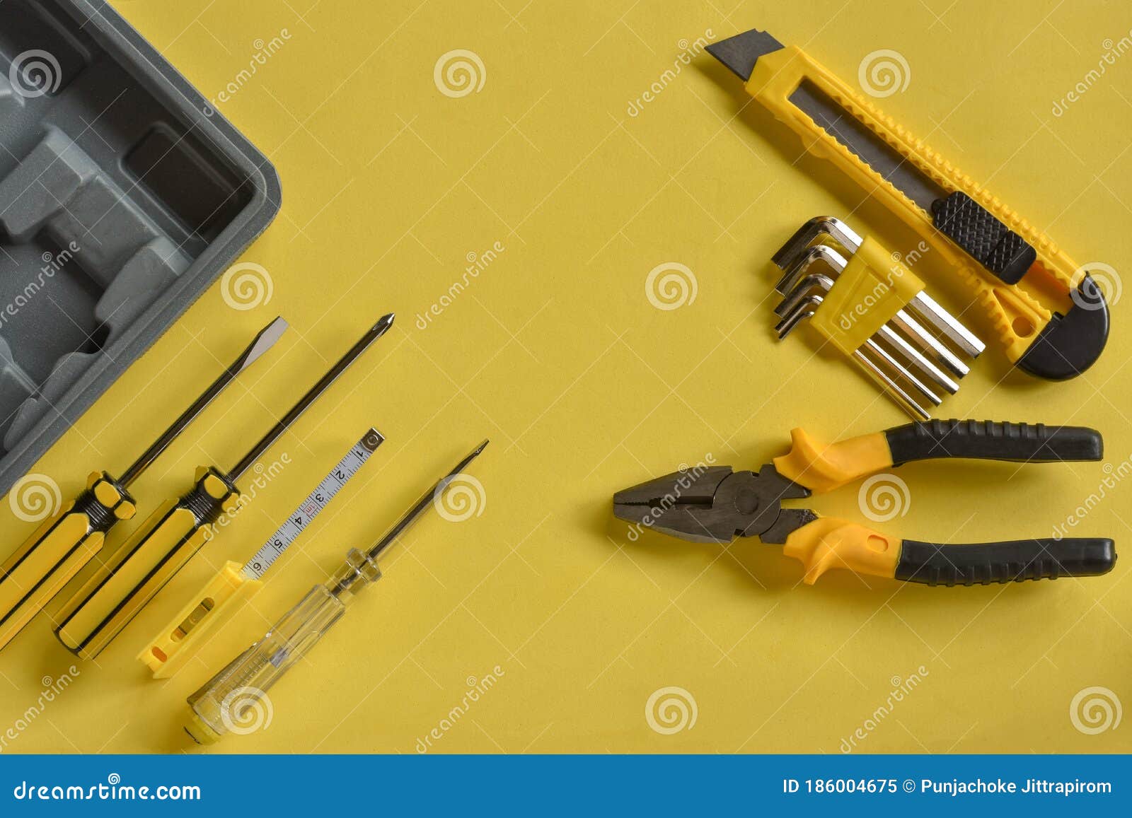 Compact Toolkit Box on Yellow Background. Stock Image - Image of ...