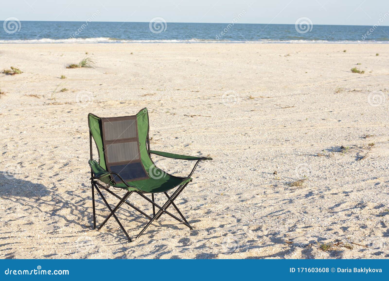 A Portable Foldable Solar Panel Hangs on a Travel Chair. Tourist ...
