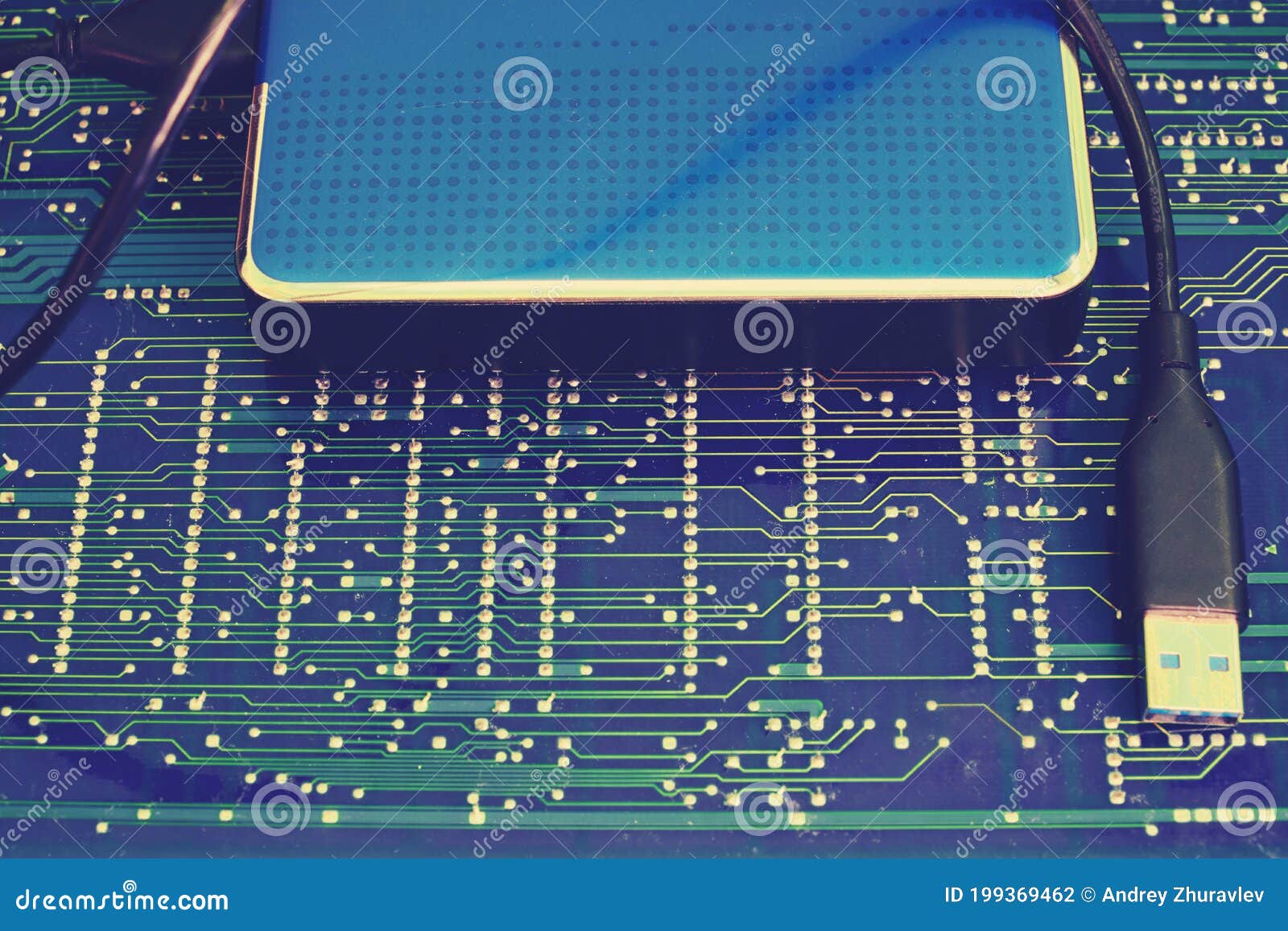 Portable Hard Disk on the Background of the Circuit Board Stock Photo ...