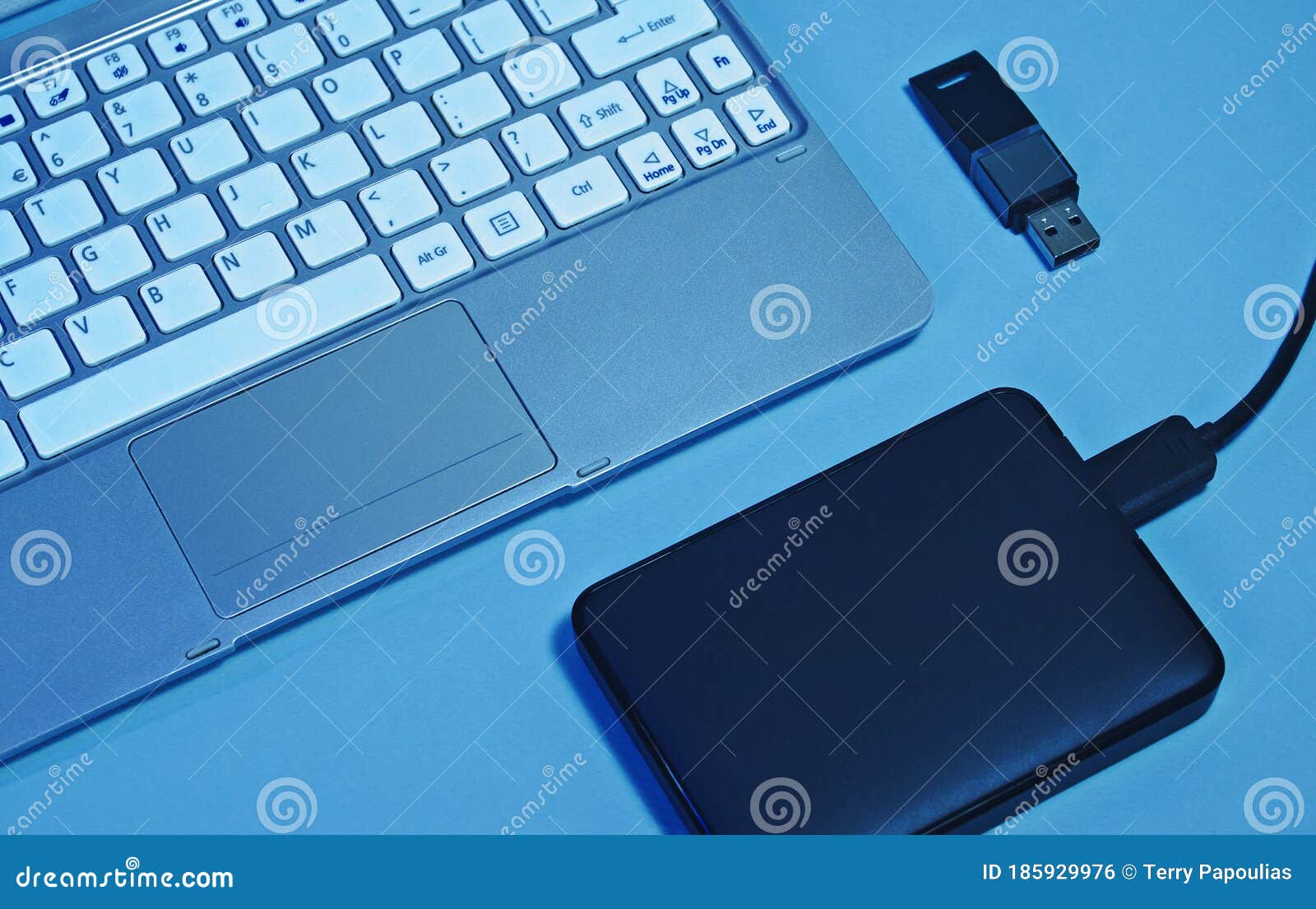 A Portable Hard Drive a Laptop and a USB Flash Drive Stock Photo ...