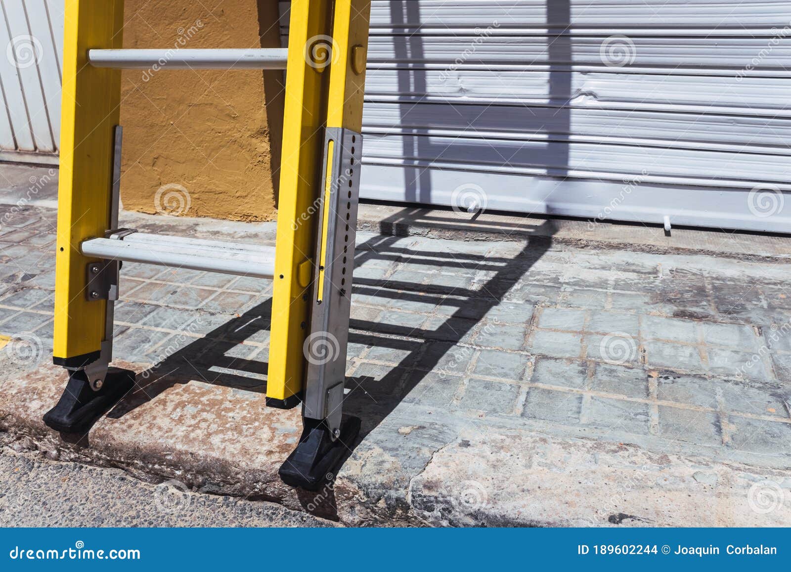 A Portable Ladder Resting on the Ground during Electrical Wiring ...