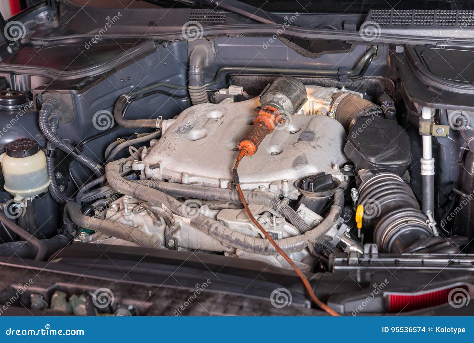 Portable Light Lying on an Open Car Engine Stock Photo - Image of ...