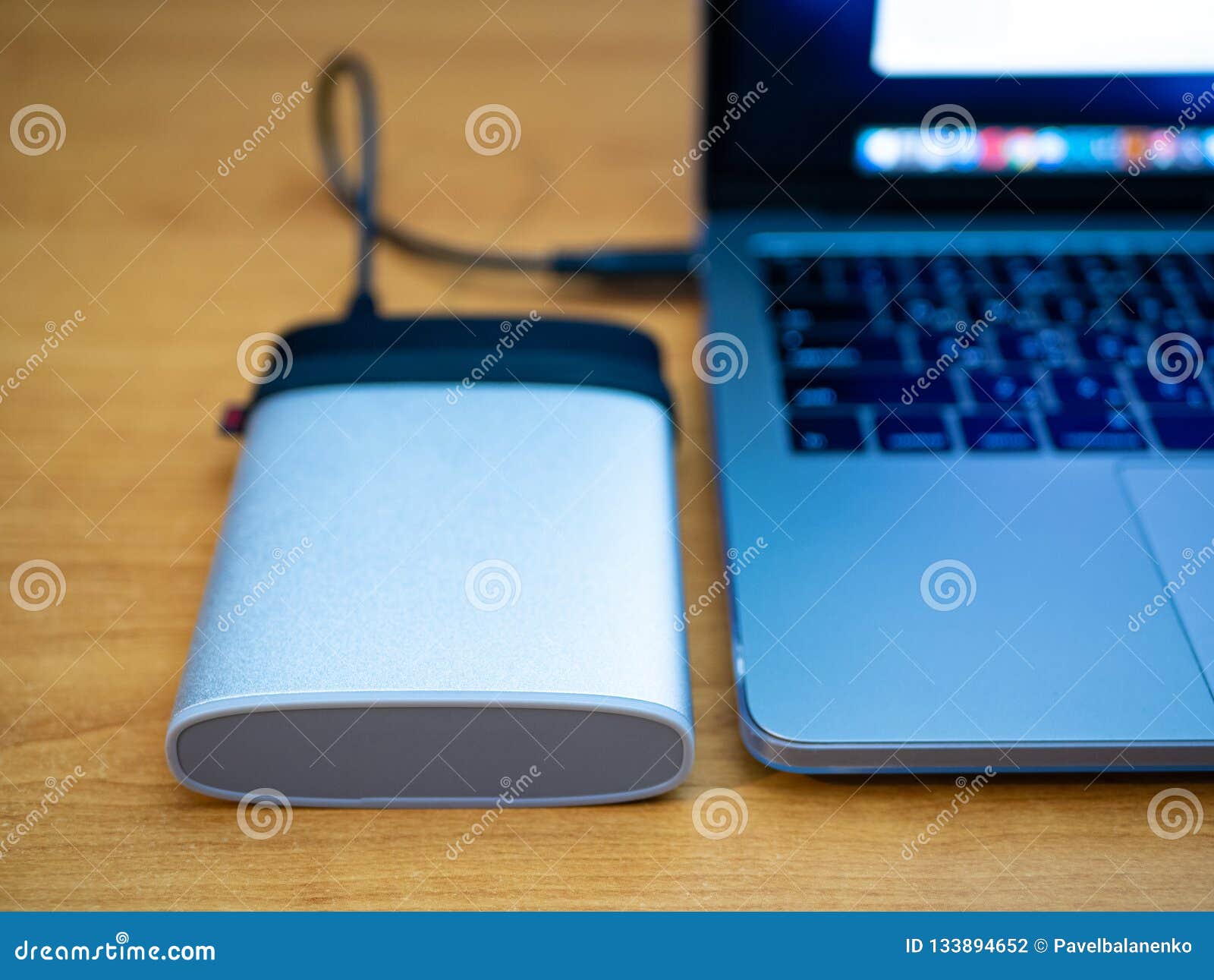 A Portable Hdd Connected To A Laptop On A Red Background Royalty-Free ...