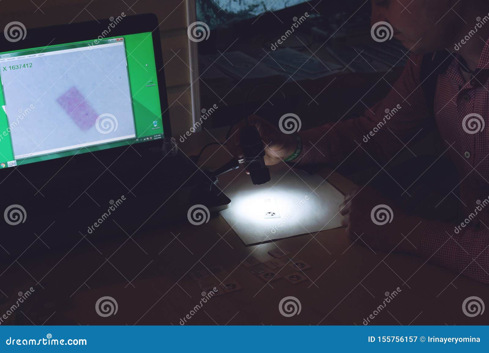 Portable USB Digital Microscope Connected To a Laptop. Man Examines ...