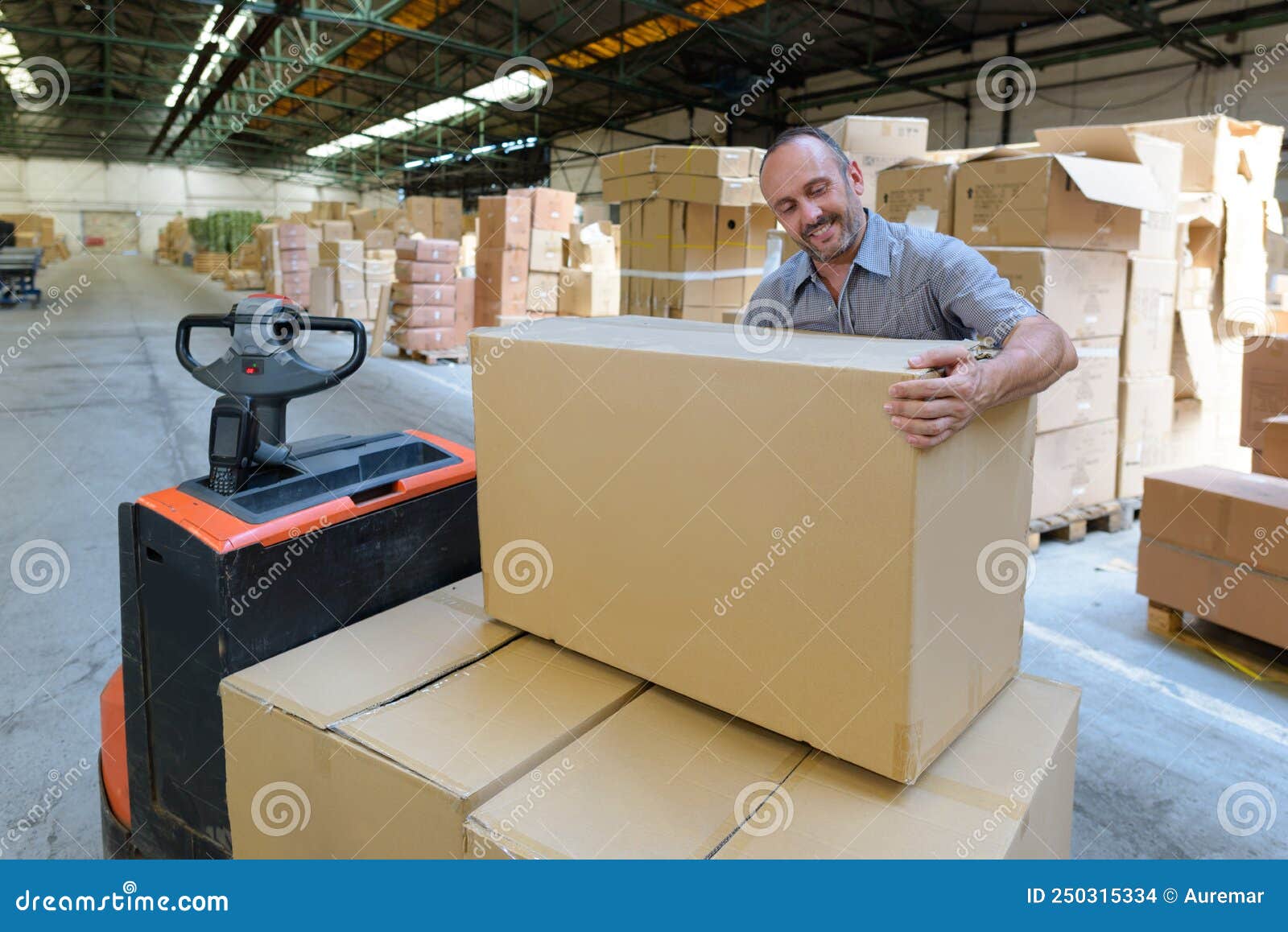 Porter Carrying Boxes in Warehouse Stock Photo - Image of logistic ...