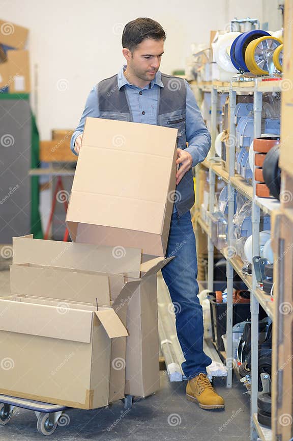Porter Carrying Boxes in Warehouse Stock Photo - Image of worker ...