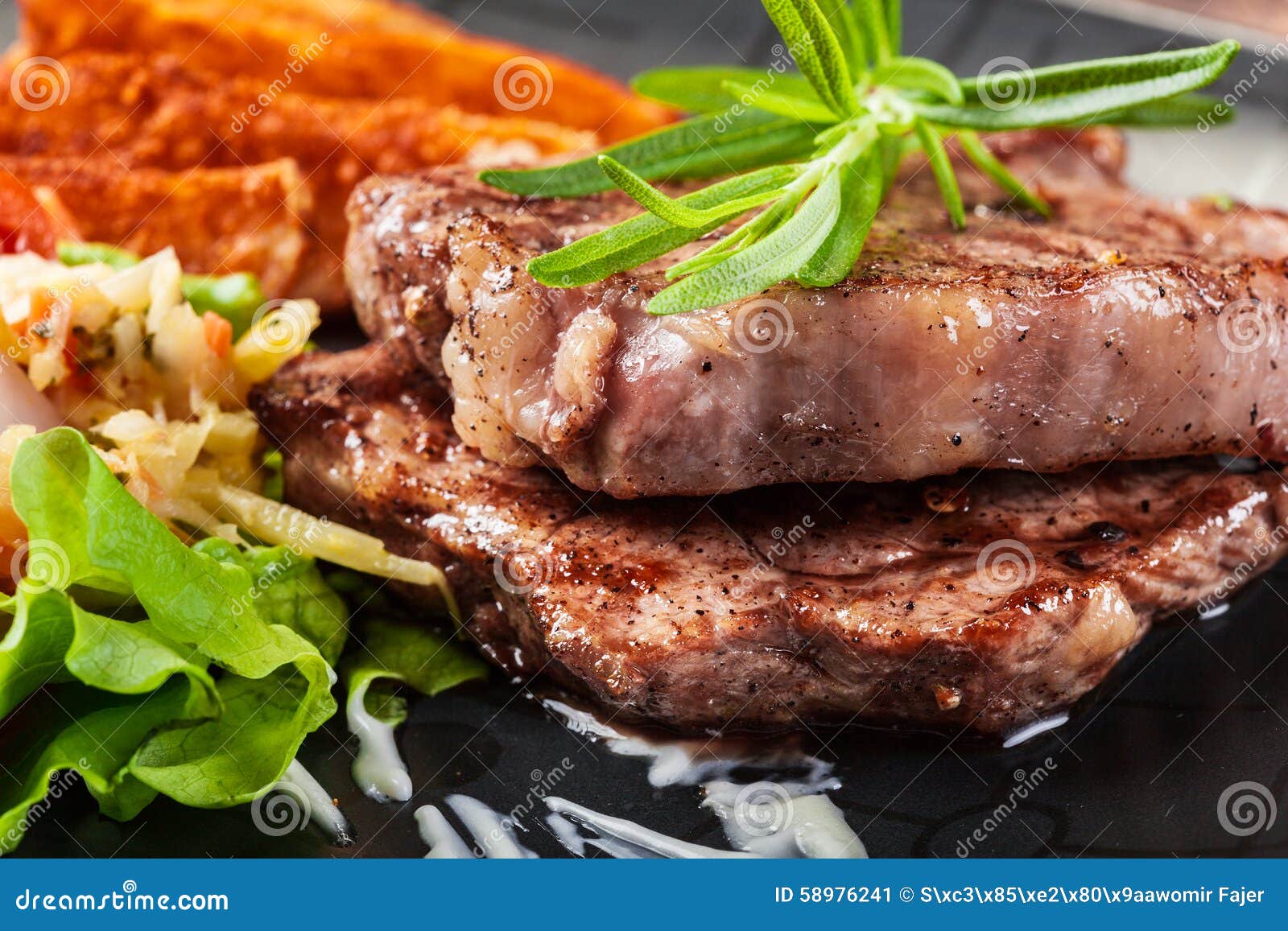 Portion of Beef Steak Served with Roast Potatoes Stock Image - Image of ...