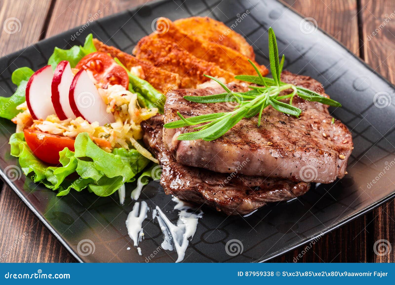 Portion of Beef Steak Served with Roast Potatoes Stock Photo - Image of ...