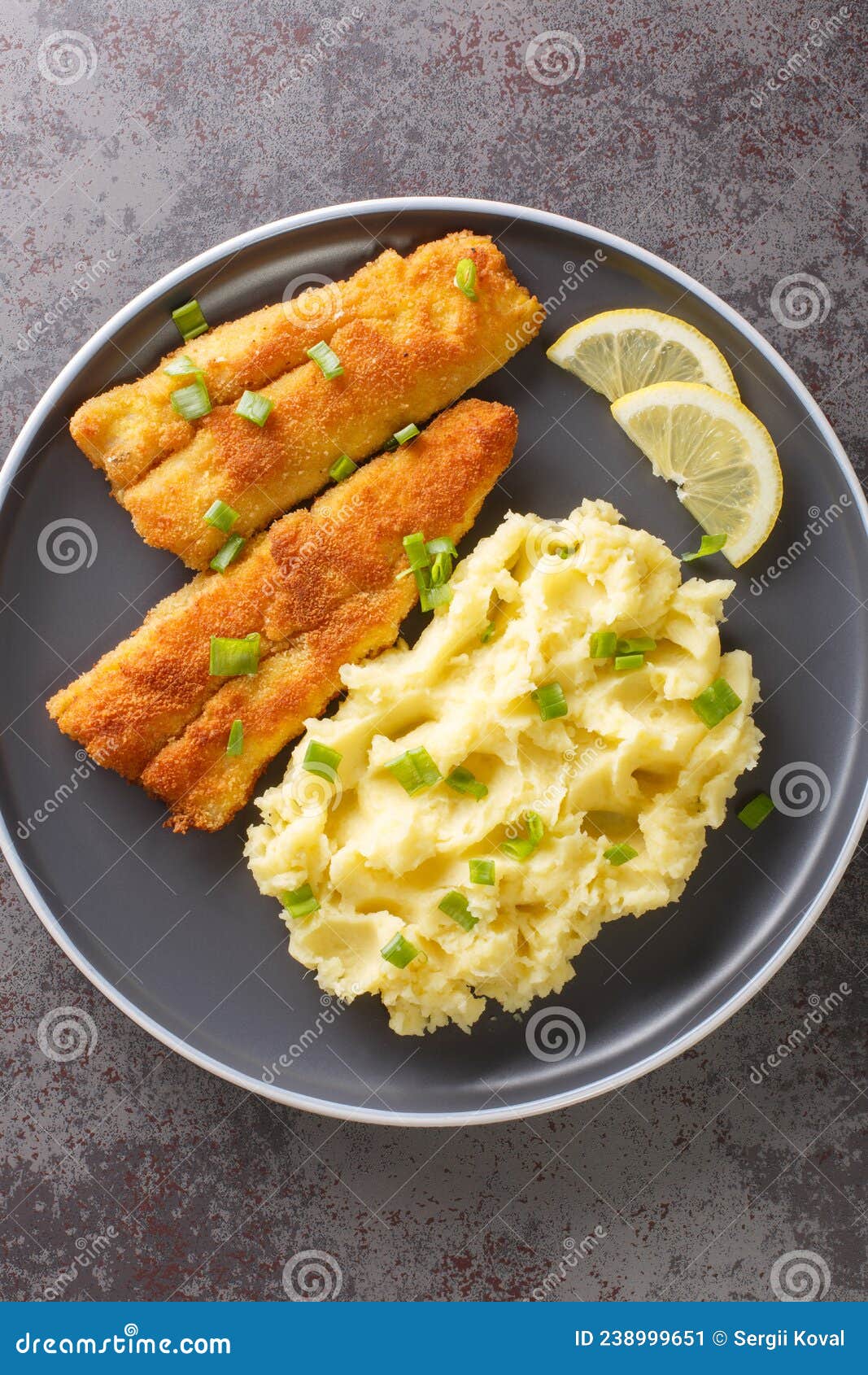 Portion of Breaded Fried Sea Fish and Mashed Potatoes Close-up in a ...