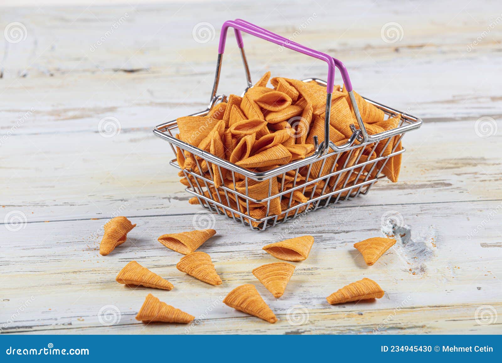 Portion of Cone Shaped Snack Tornado Shaped Crackers. Yellow Spicy ...