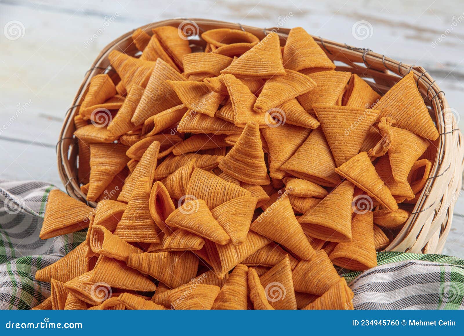 Portion Of Cone Shaped Snack Tornado Shaped Crackers. Yellow Spicy ...