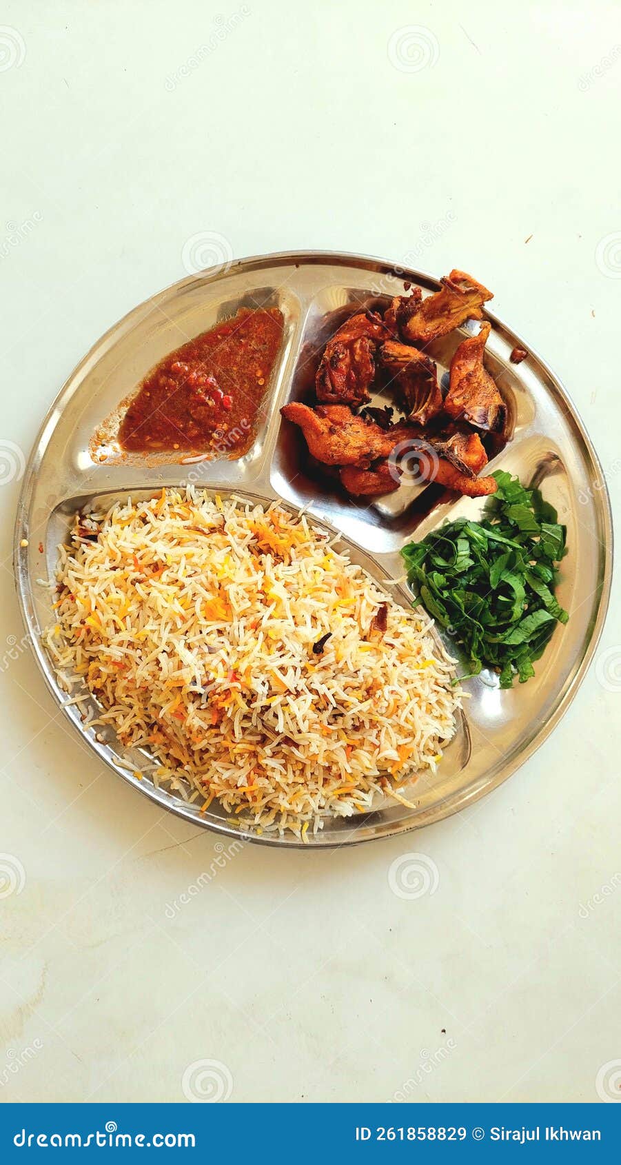 A Portion of Food Containing Rice, Fried Chicken, and Vegetables Stock ...