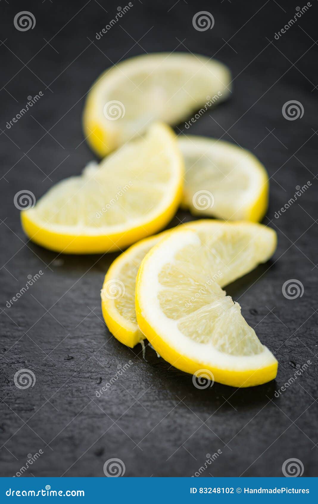 Portion of Lemon Sliced on a Slate Slab Stock Photo - Image of close ...
