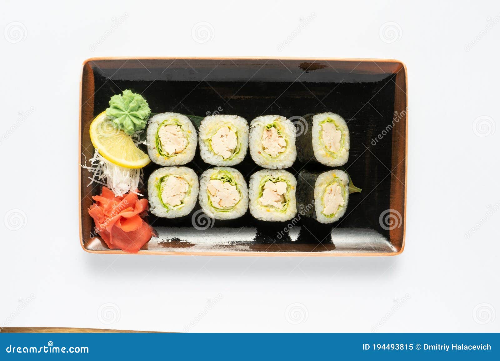 A Portion of Maki Sushi with an Assortment of Japanese Side Dishes in a ...