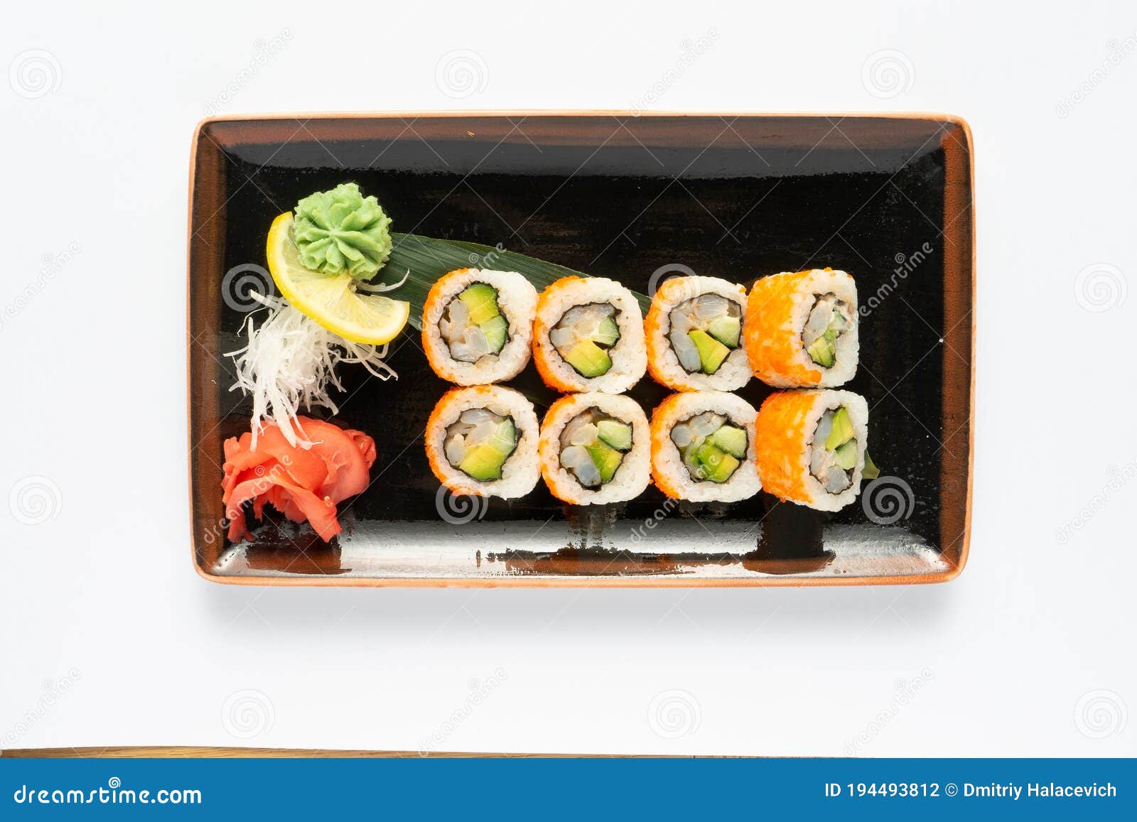 A Portion of Maki Sushi with an Assortment of Japanese Side Dishes in a ...
