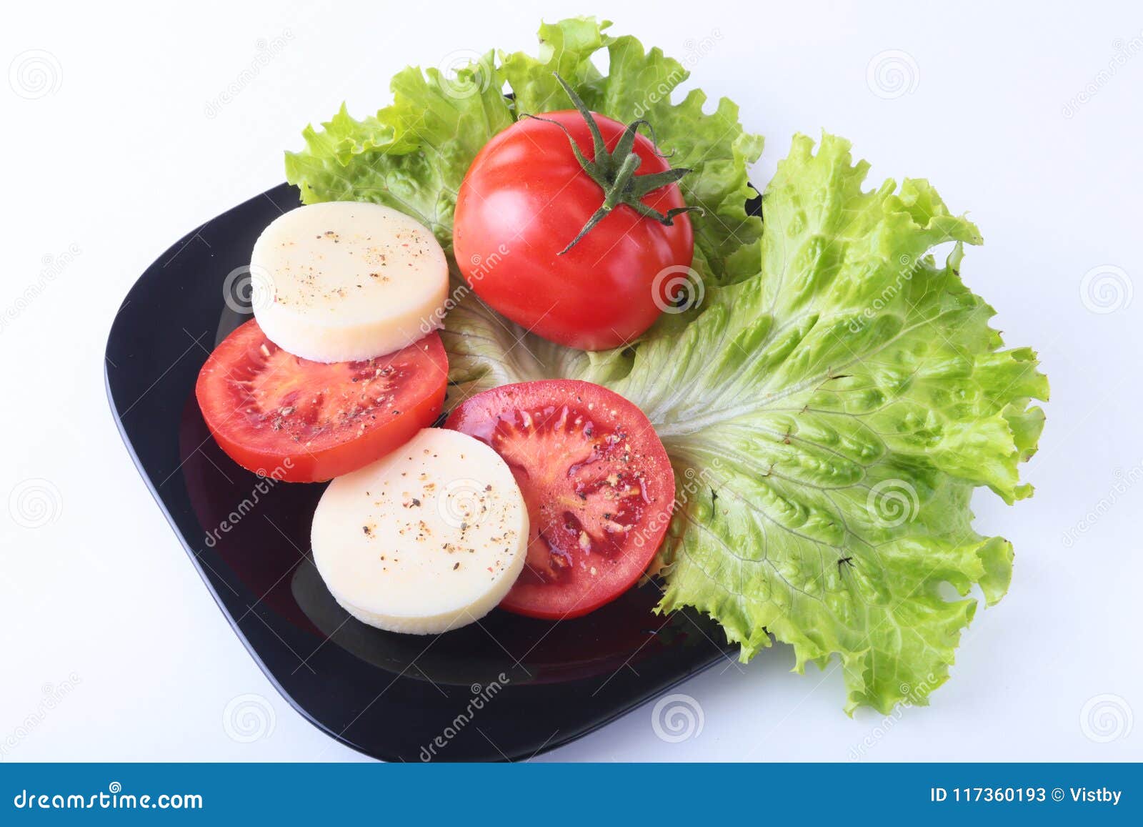 Portion of Mozzarella with Tomatoes, Lettuce Leaf and Balsamic Dressing ...