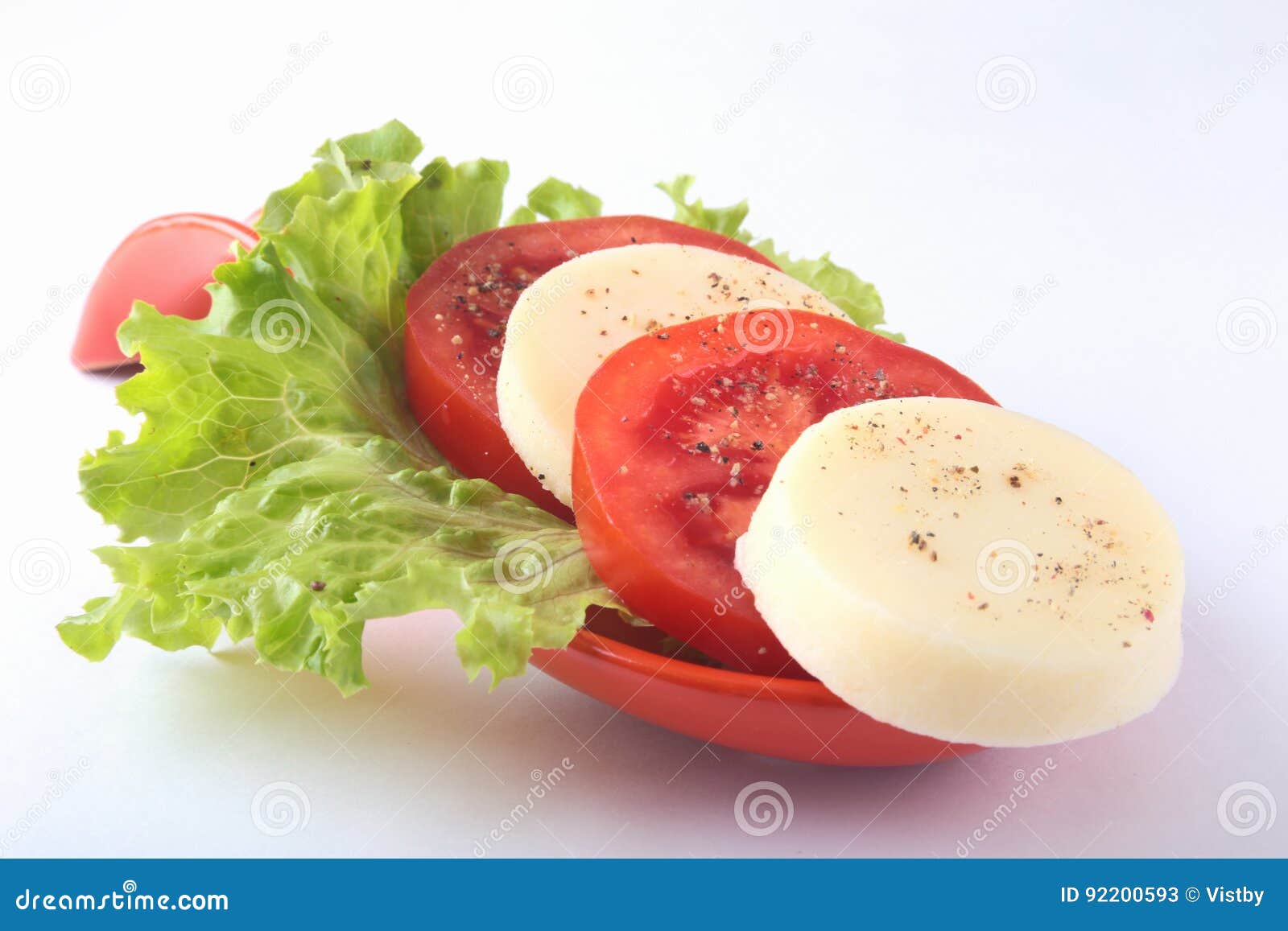 Portion of Mozzarella with Tomatoes, Lettuce Leaf and Balsamic Dressing ...