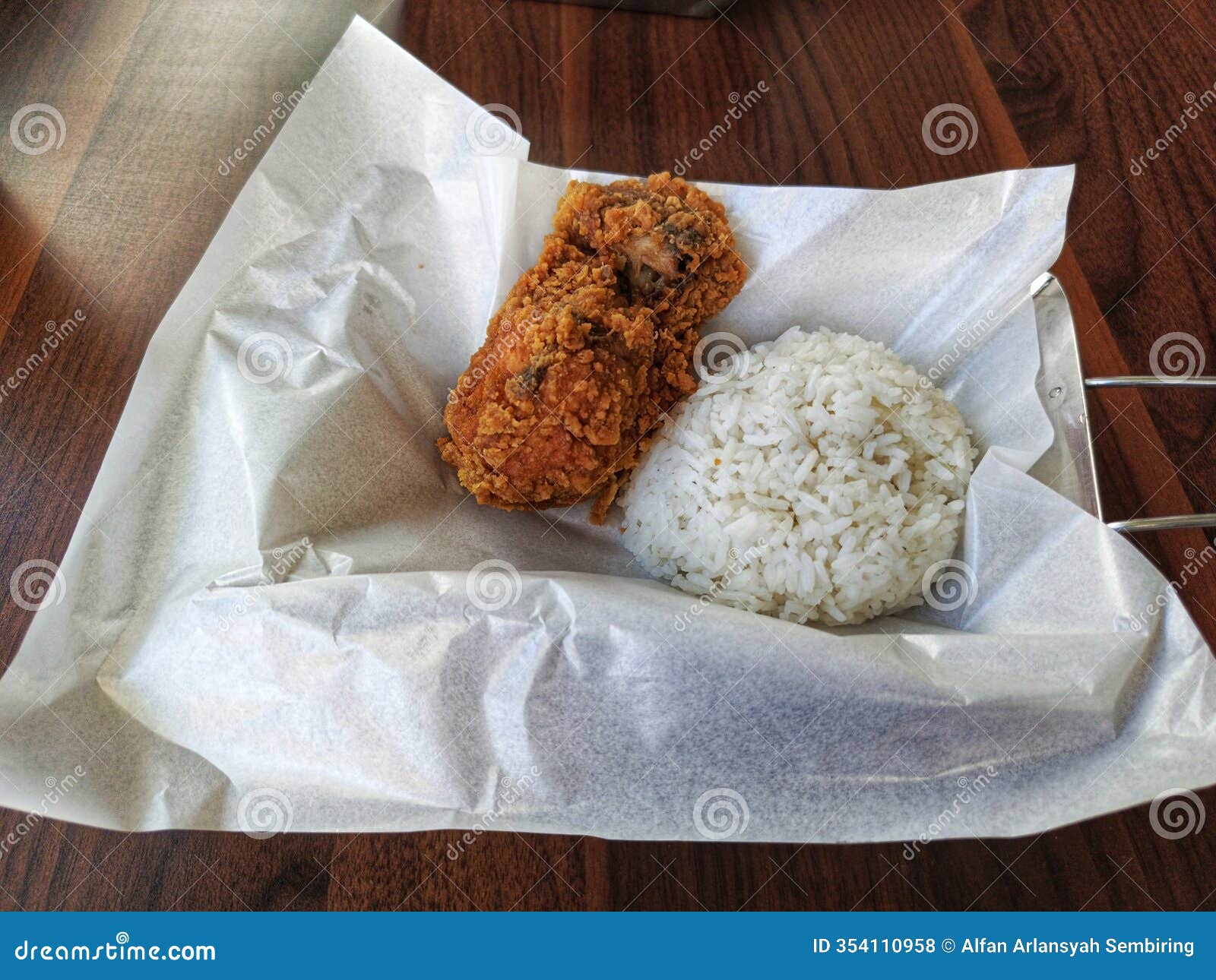 A Portion Of Rice And Fried Chicken On An Environmentally Friendly ...