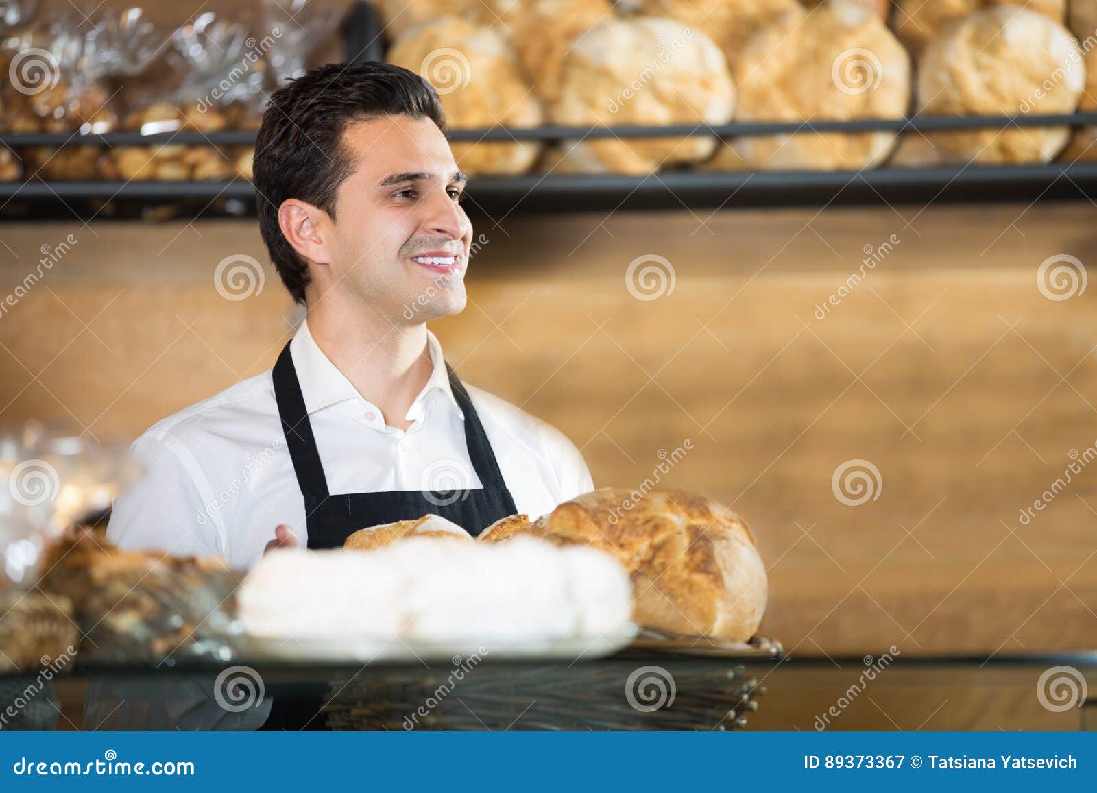 Portraint of Young Man at Bakery Display Stock Image - Image of patty ...