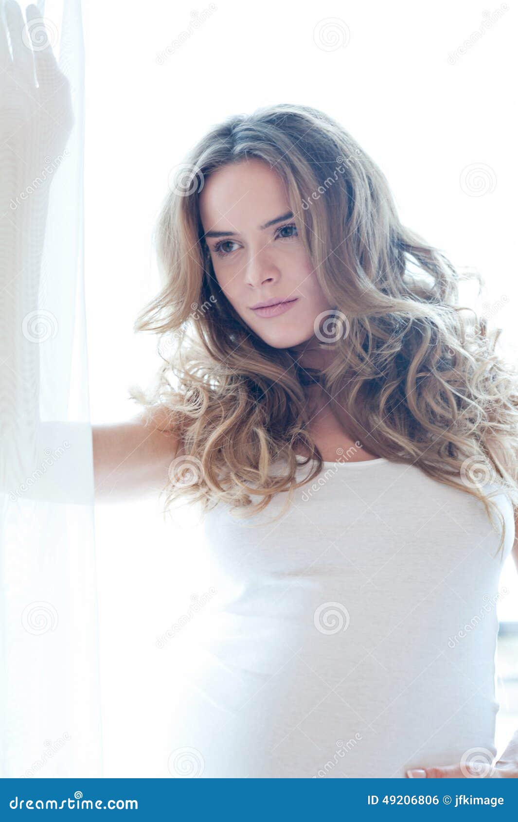 Portrait Of Adorable Lovely Beautiful And Pregnant Woman In White