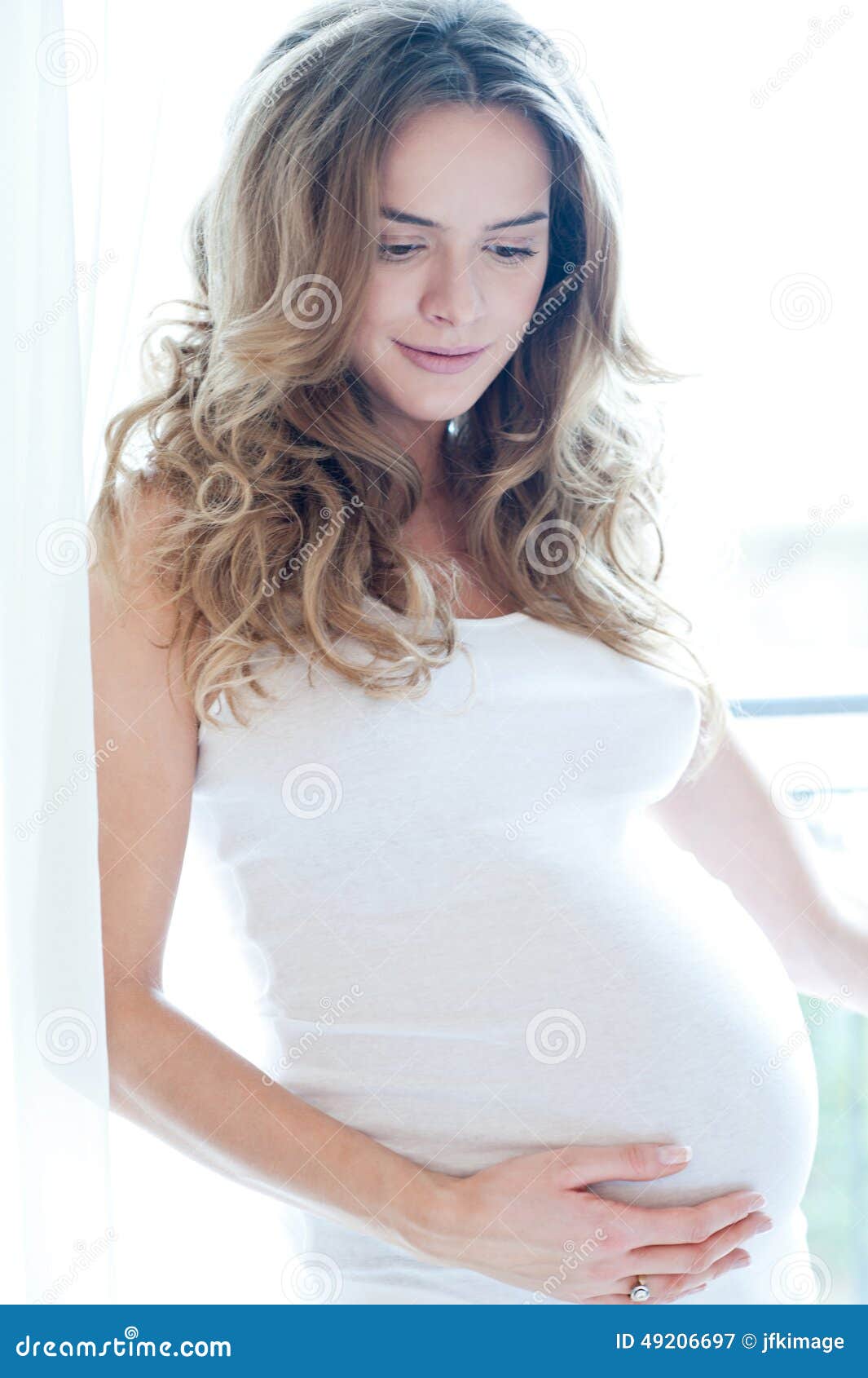Portrait Of Adorable Pregnant Woman In White Paradise Stock Image