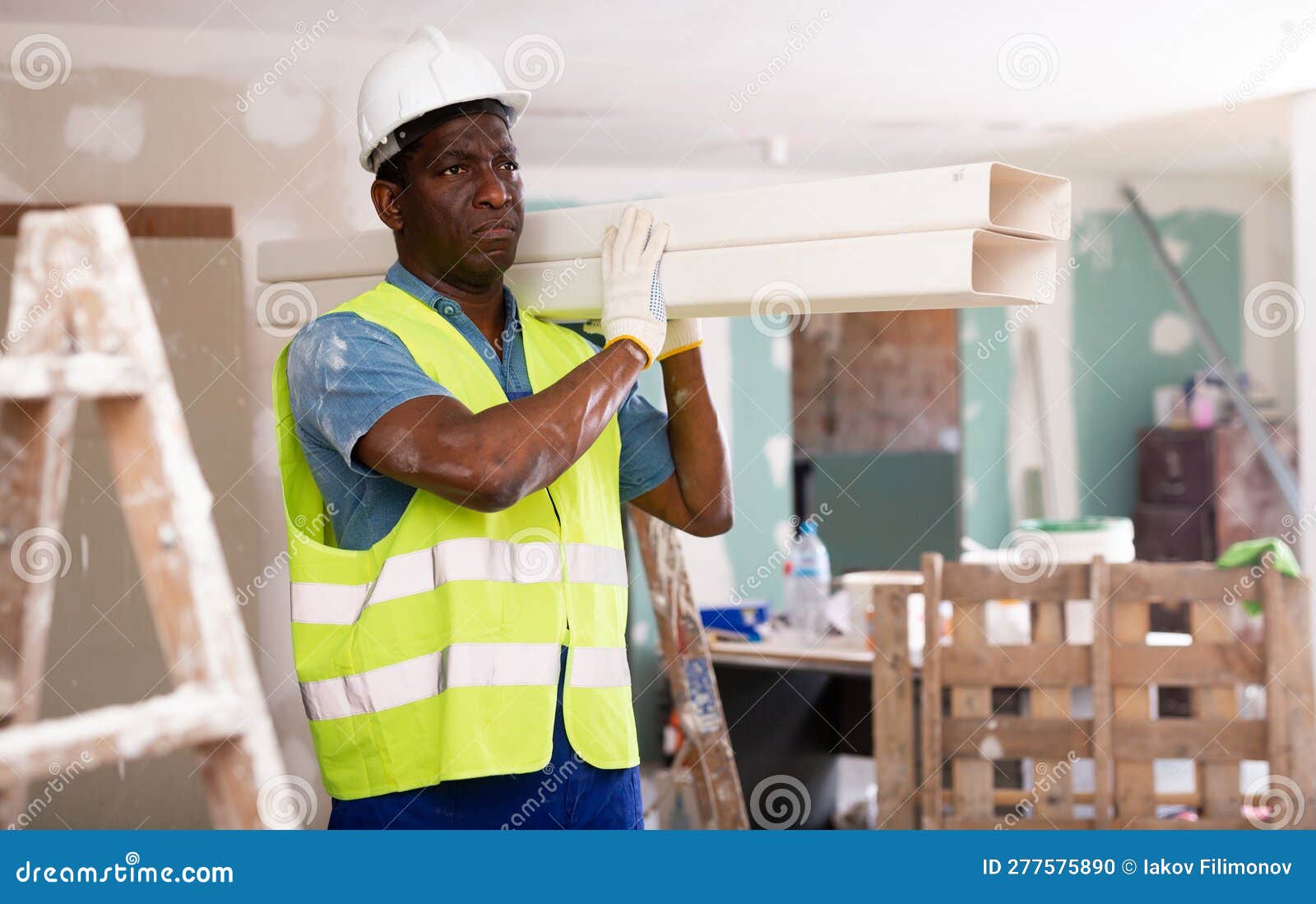 Portrait of an African American Builder, Working in the Process of ...