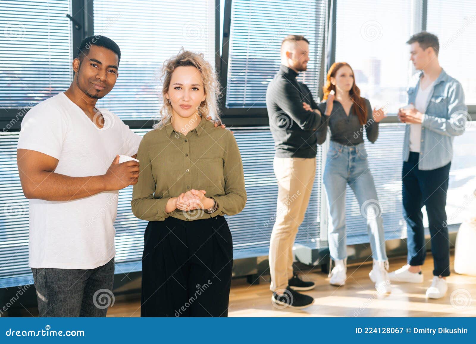 Portrait Of African American Male Posing With Young Woman Colleague