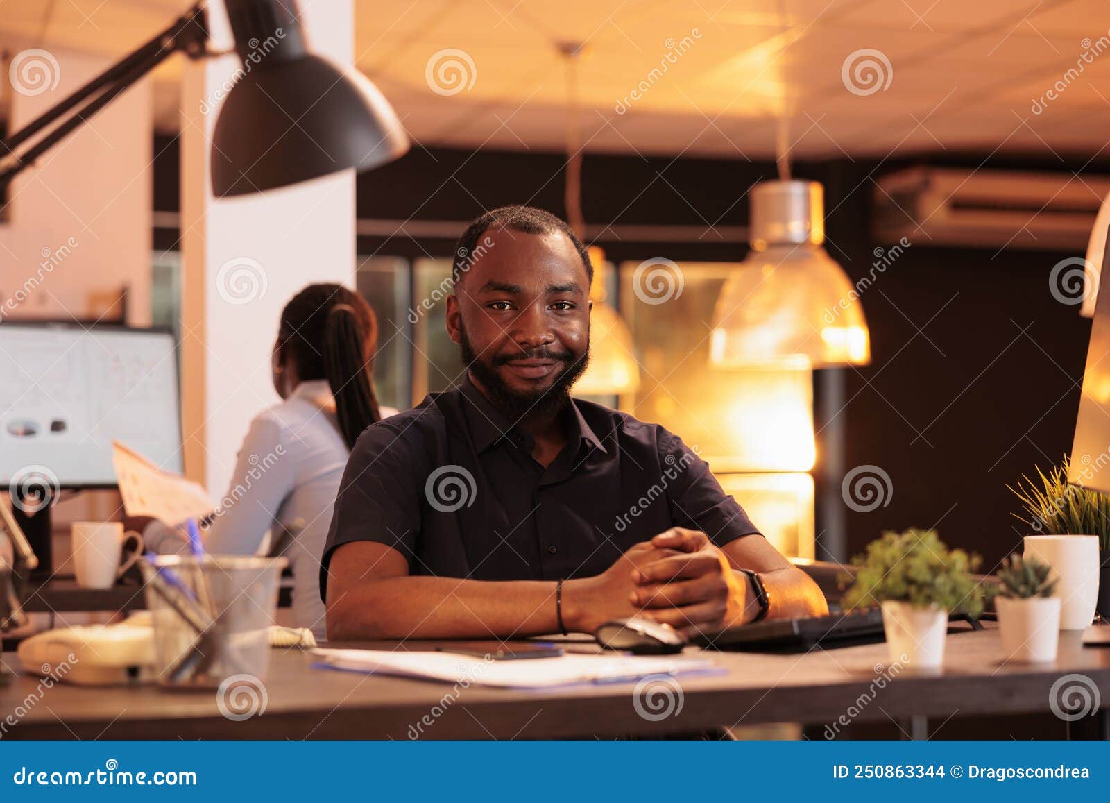 Portrait of African American Man Working on Computer at Desk Stock ...