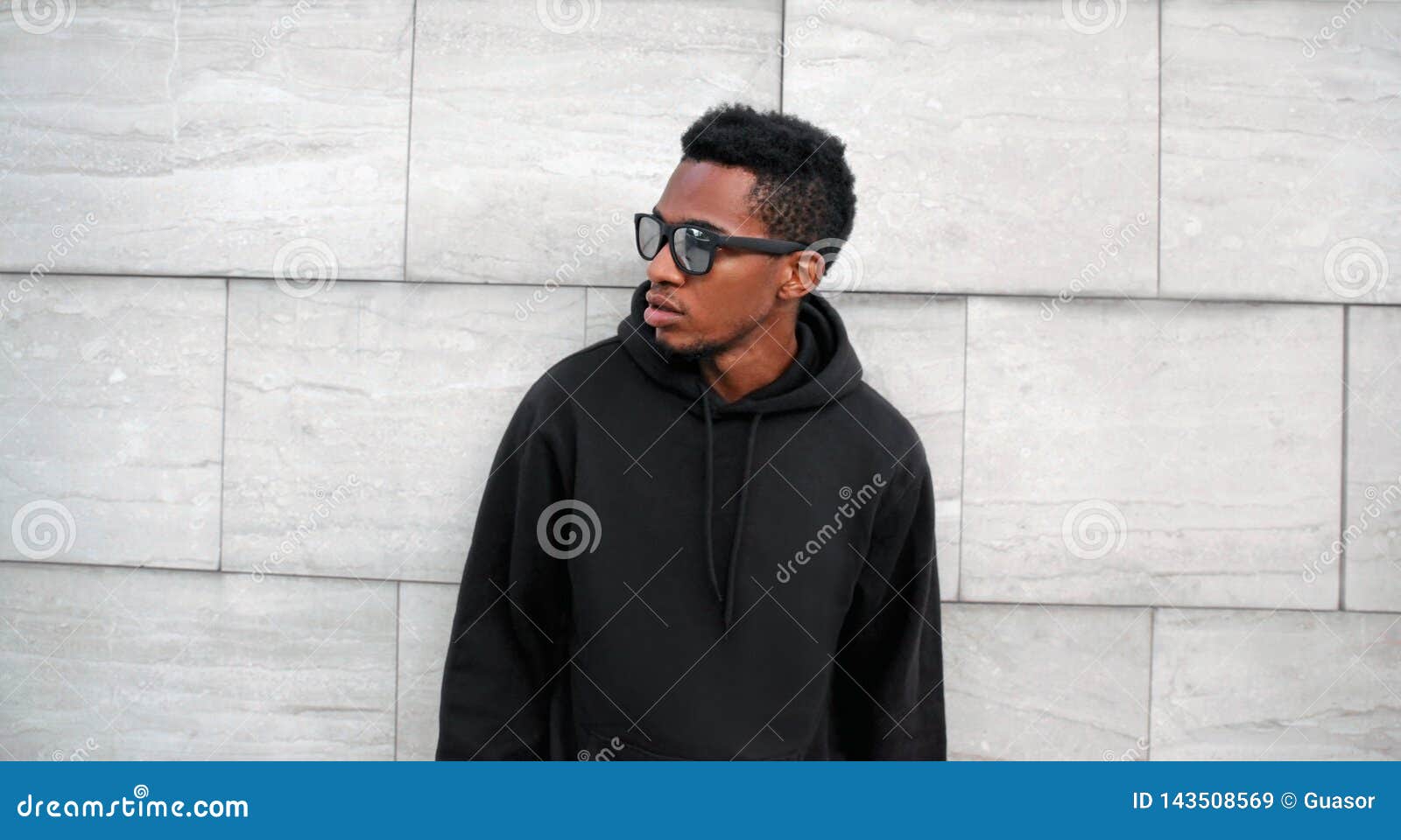Portrait African Man in Black Hoodie, Sunglasses Looking Away on City ... Portrait African Man in Black Hoodie, Sunglasses Looking Away on City ...