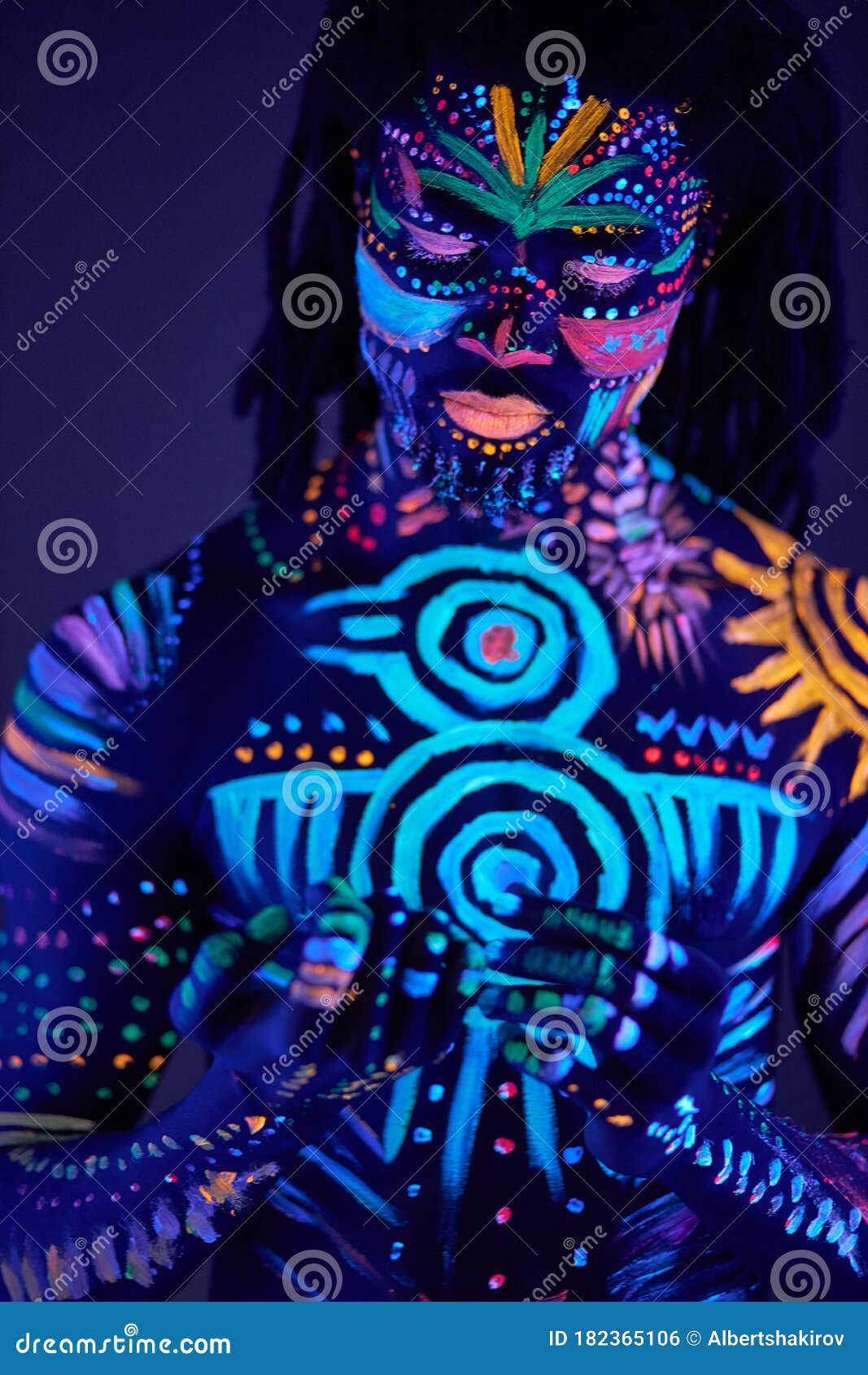 Portrait of African Man with Ethnic Pattern, Neon Makeup in Ultraviolet ... Portrait of African Man with Ethnic Pattern, Neon Makeup in Ultraviolet ...