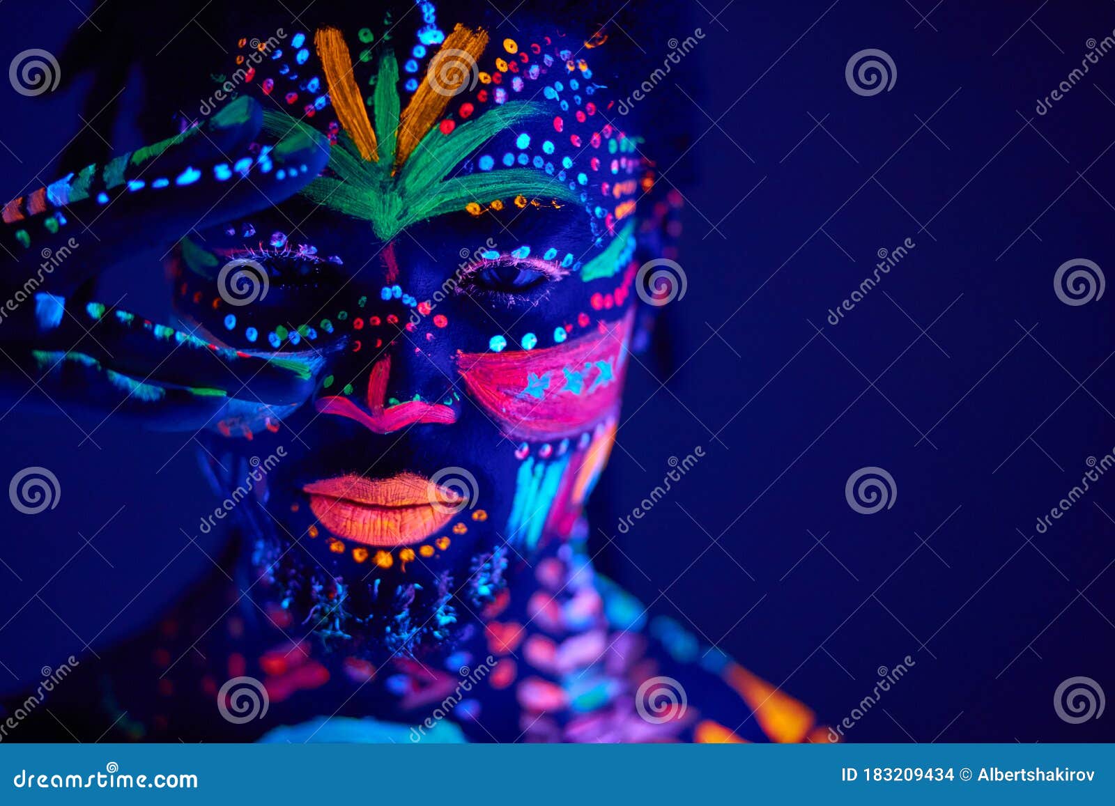Portrait of African Man with Ethnic Pattern, Neon Makeup in Ultraviolet ... Portrait of African Man with Ethnic Pattern, Neon Makeup in Ultraviolet ...