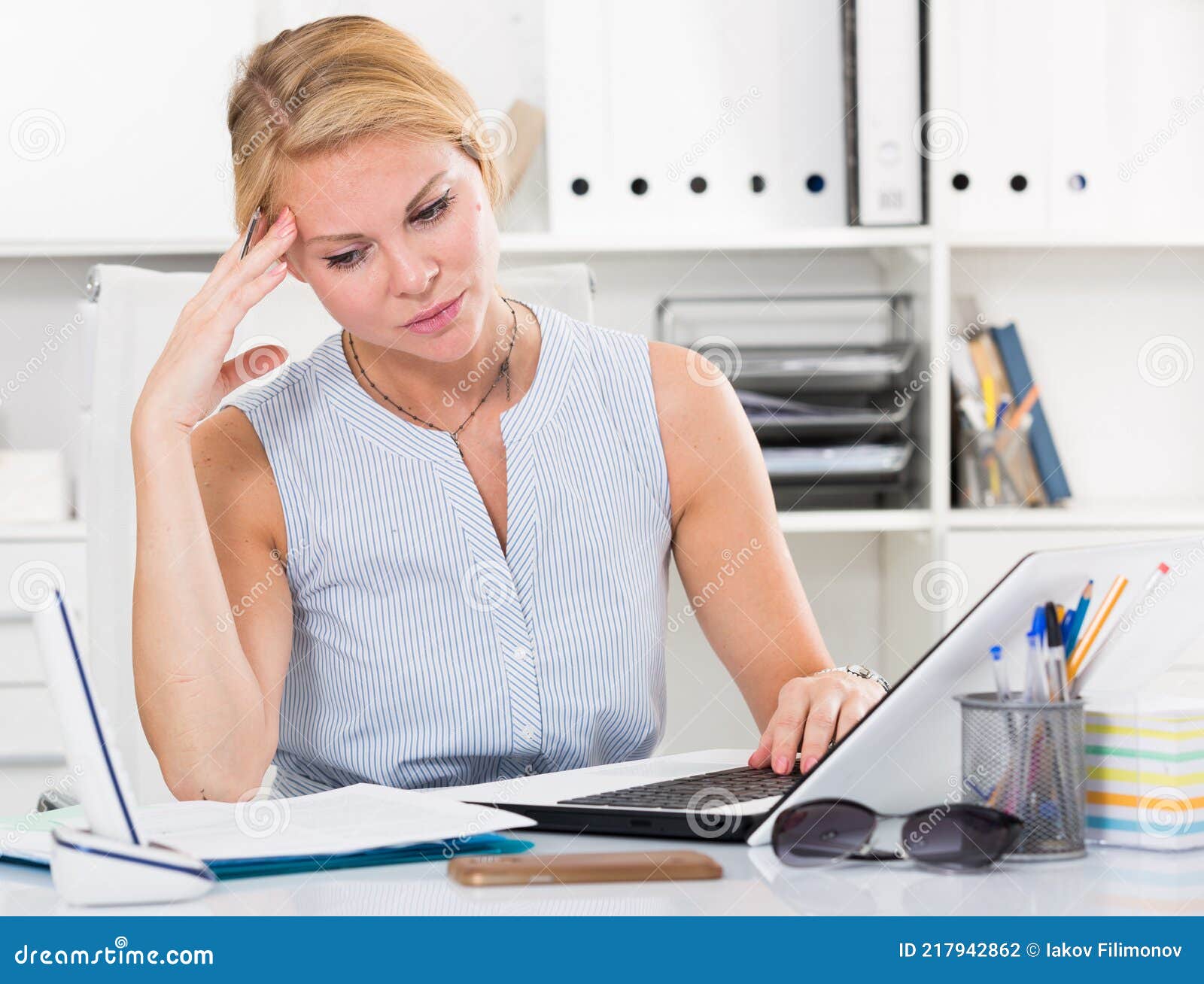 Portrait of Angry Female Secretary Working with Documents and Computer ...