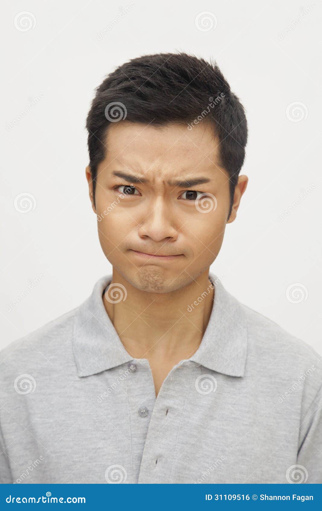 Portrait of Angry and Frustrated Young Man, Studio Shot, Looking at ...