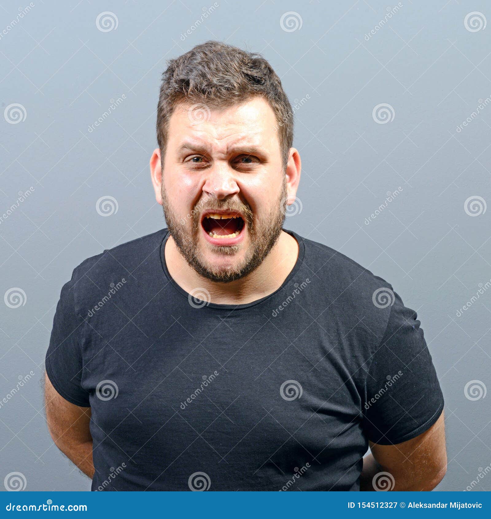 Portrait of a Angry Man Screaming Against Gray Background Stock Image ...