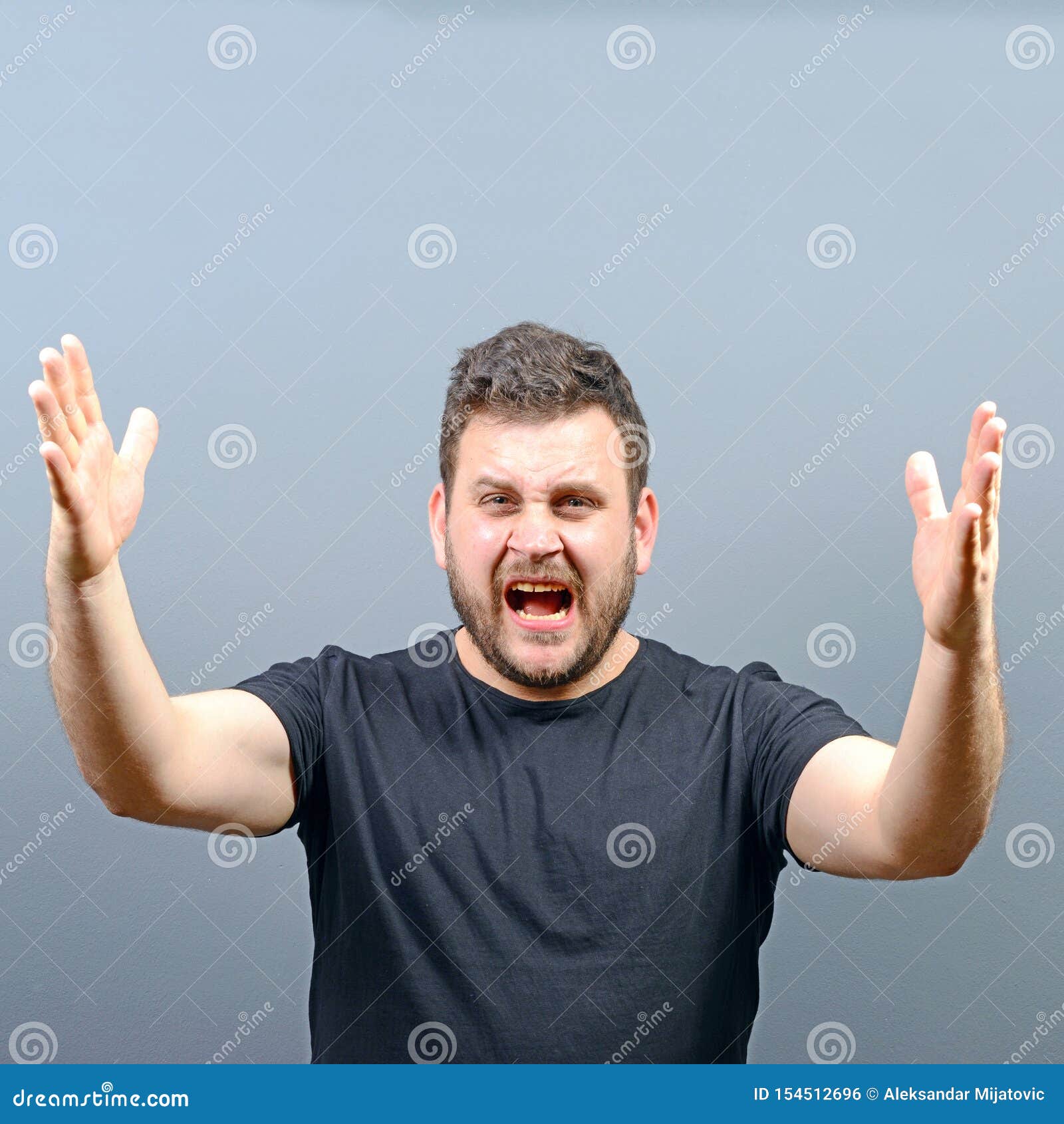 Portrait of a Angry Man Screaming Against Gray Background Stock Photo ...