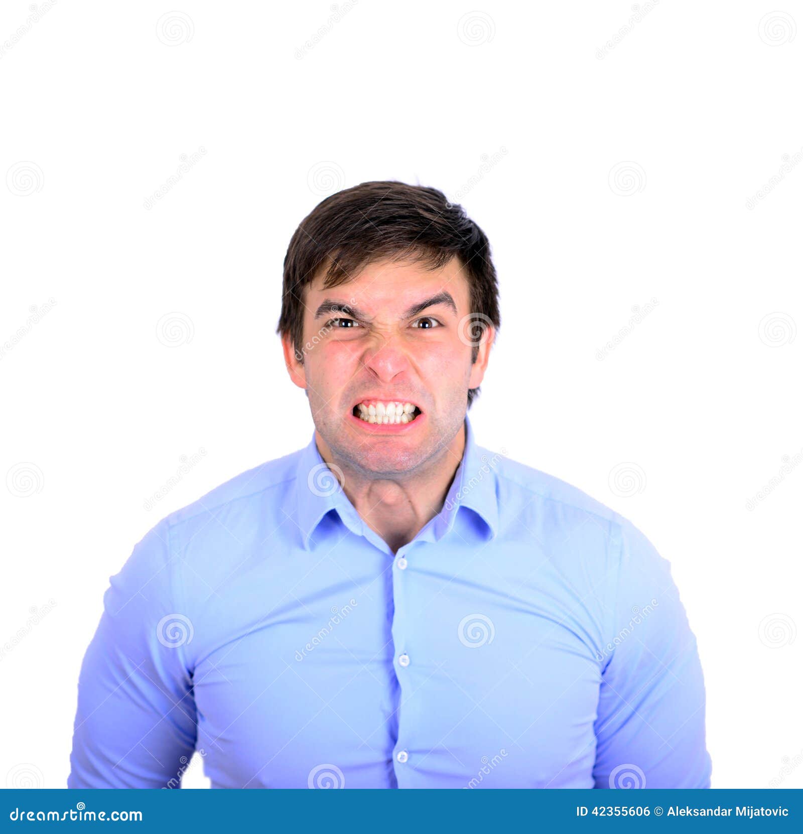 Portrait of Angry Young Man Looking Straight Forward Stock Photo ...