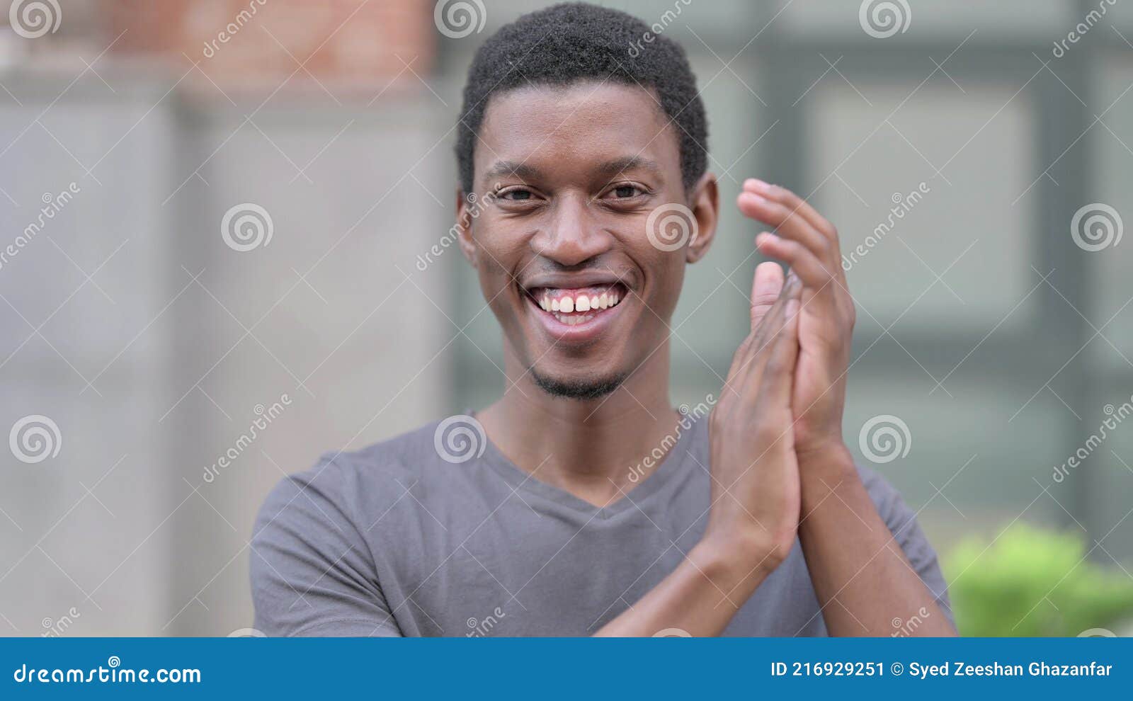Portrait of Appreciative Young Young African Man Clapping Stock Image ...