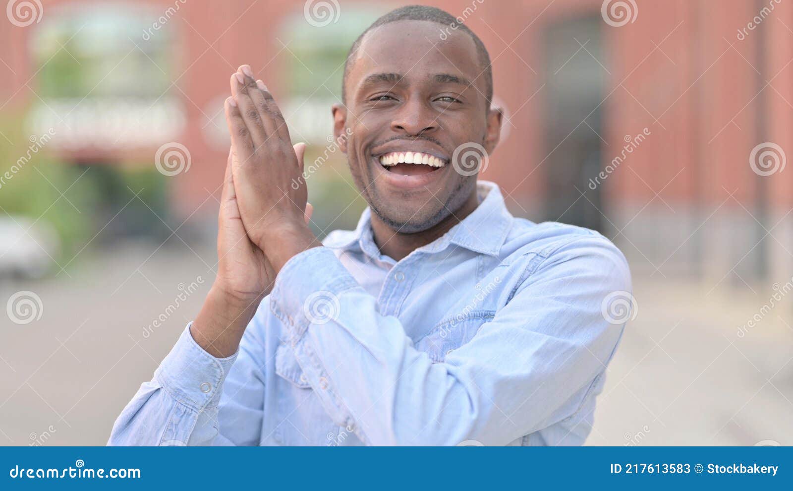Portrait of Appreciative Young African Man Clapping Stock Image - Image ...
