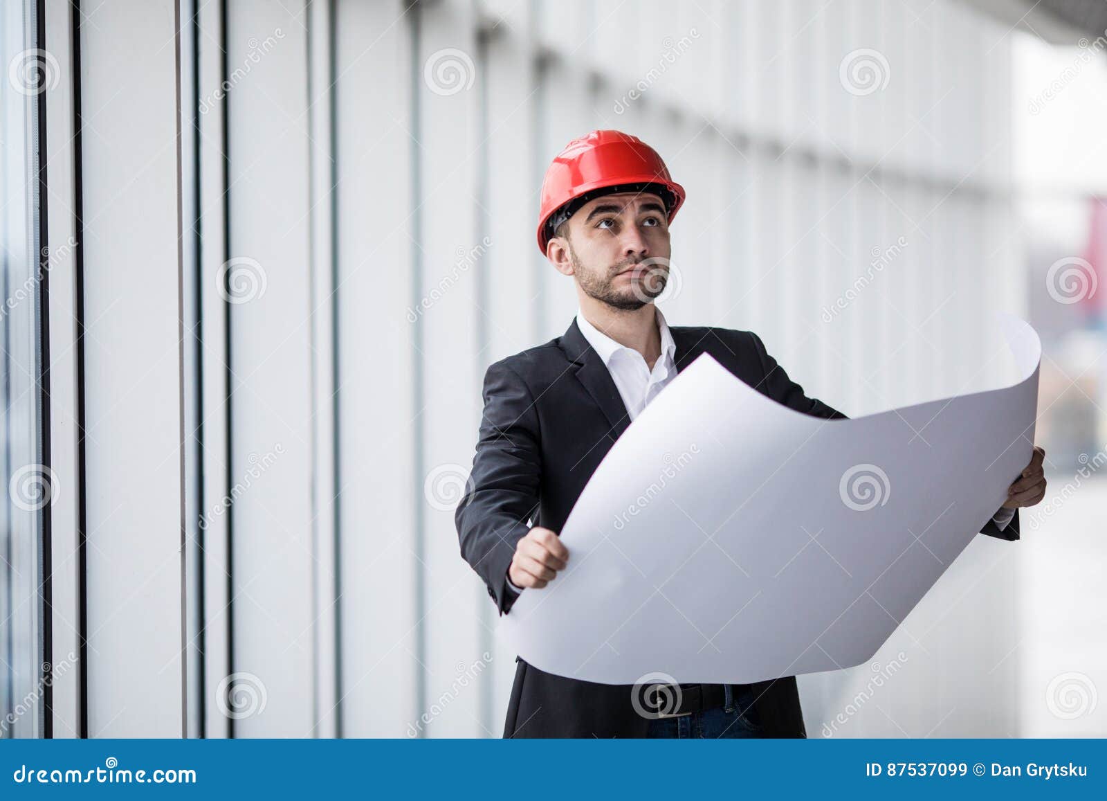 Portrait of an Architect Builder Studying Layout Plan of the Building ...