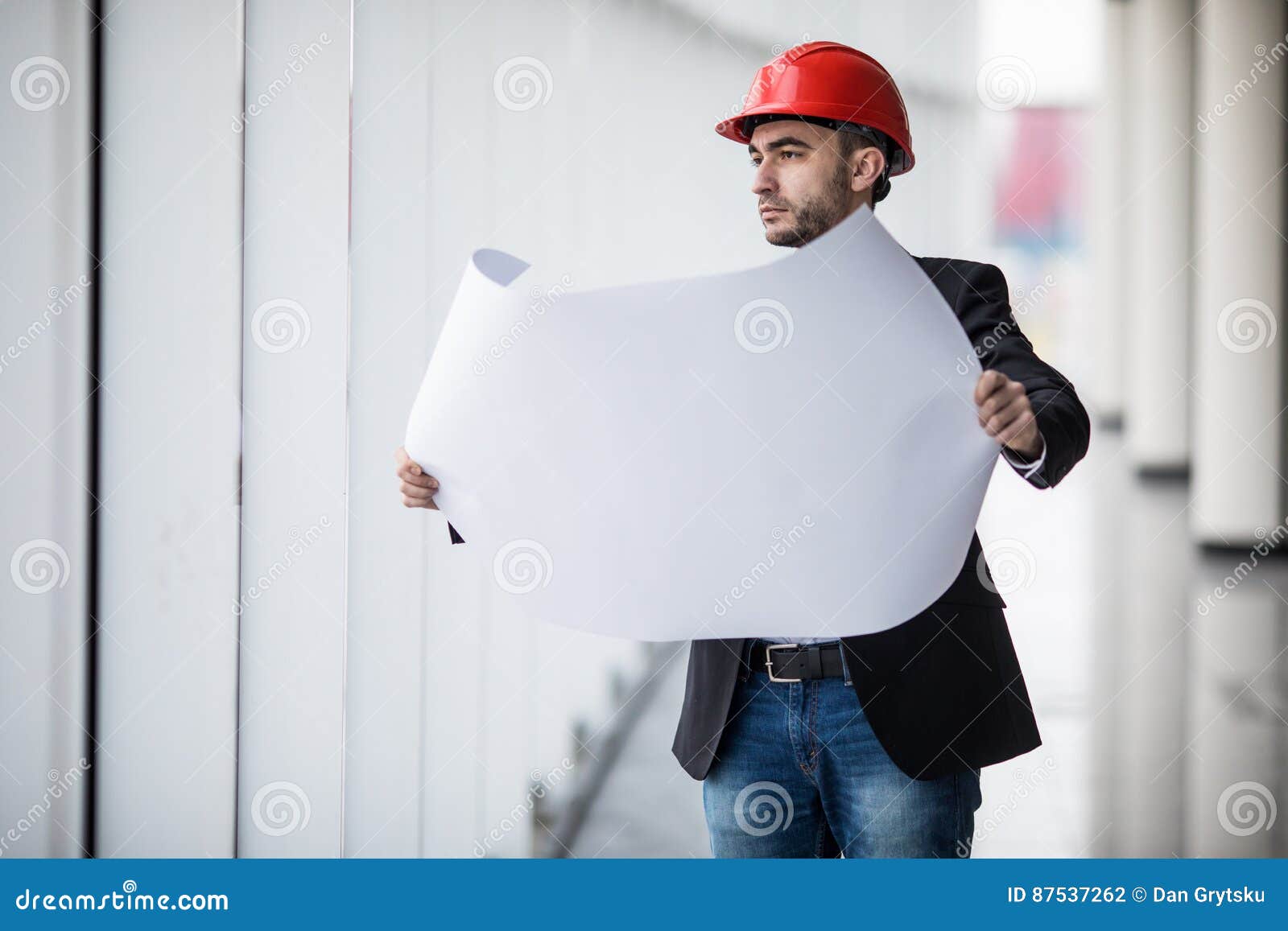 Portrait of an Architect Builder Studying Layout Plan of the Building ...