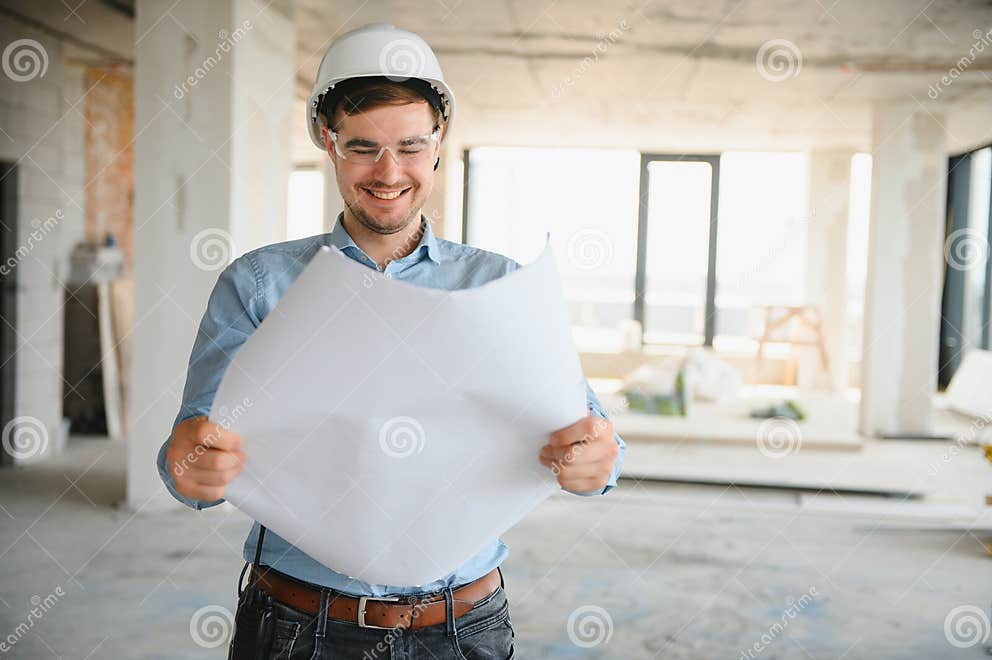 Portrait of an Architect Builder Studying Layout Plan of the Rooms ...
