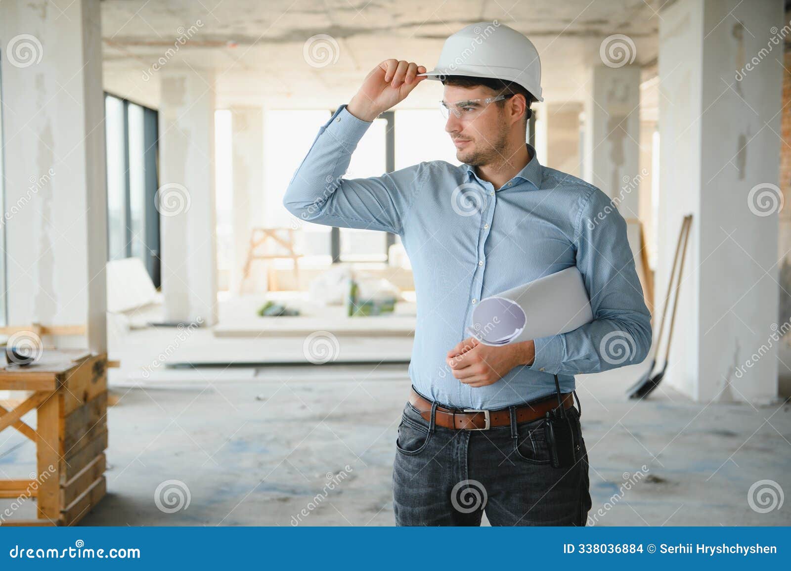 Portrait of an Architect Builder Studying Layout Plan of the Rooms ...