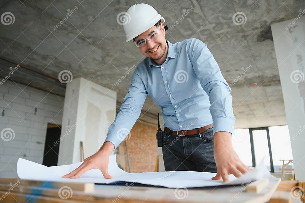 Portrait of an Architect Builder Studying Layout Plan of the Rooms ...