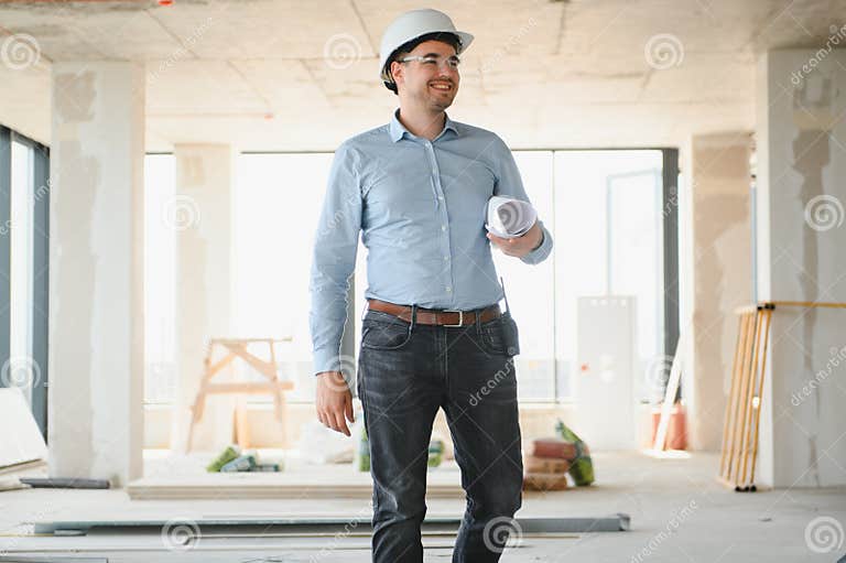 Portrait of an Architect Builder Studying Layout Plan of the Rooms ...