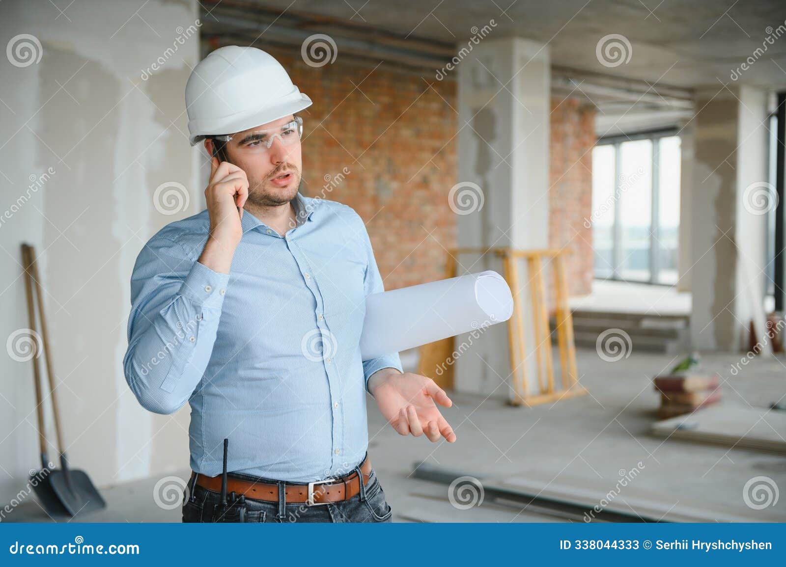 Portrait of an Architect Builder Studying Layout Plan of the Rooms ...
